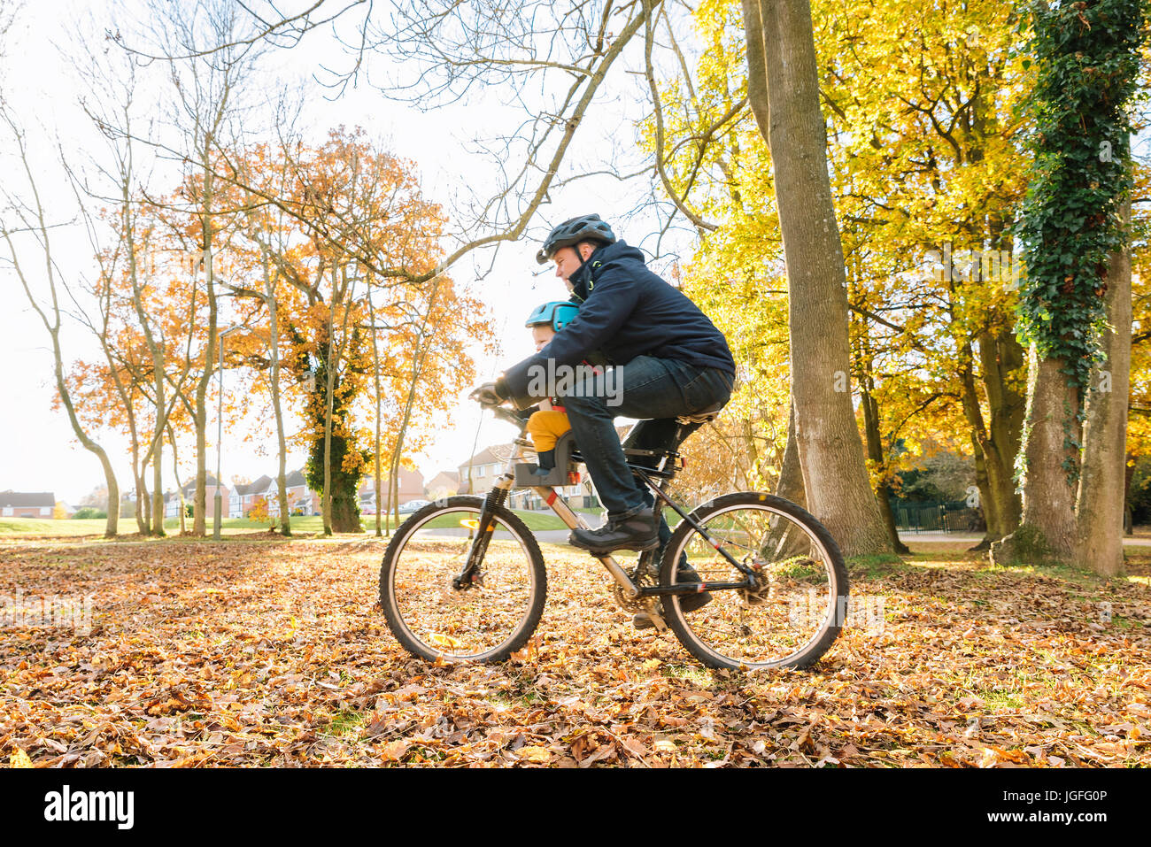 Child riding bicycle side view helmet hi-res stock photography and ...