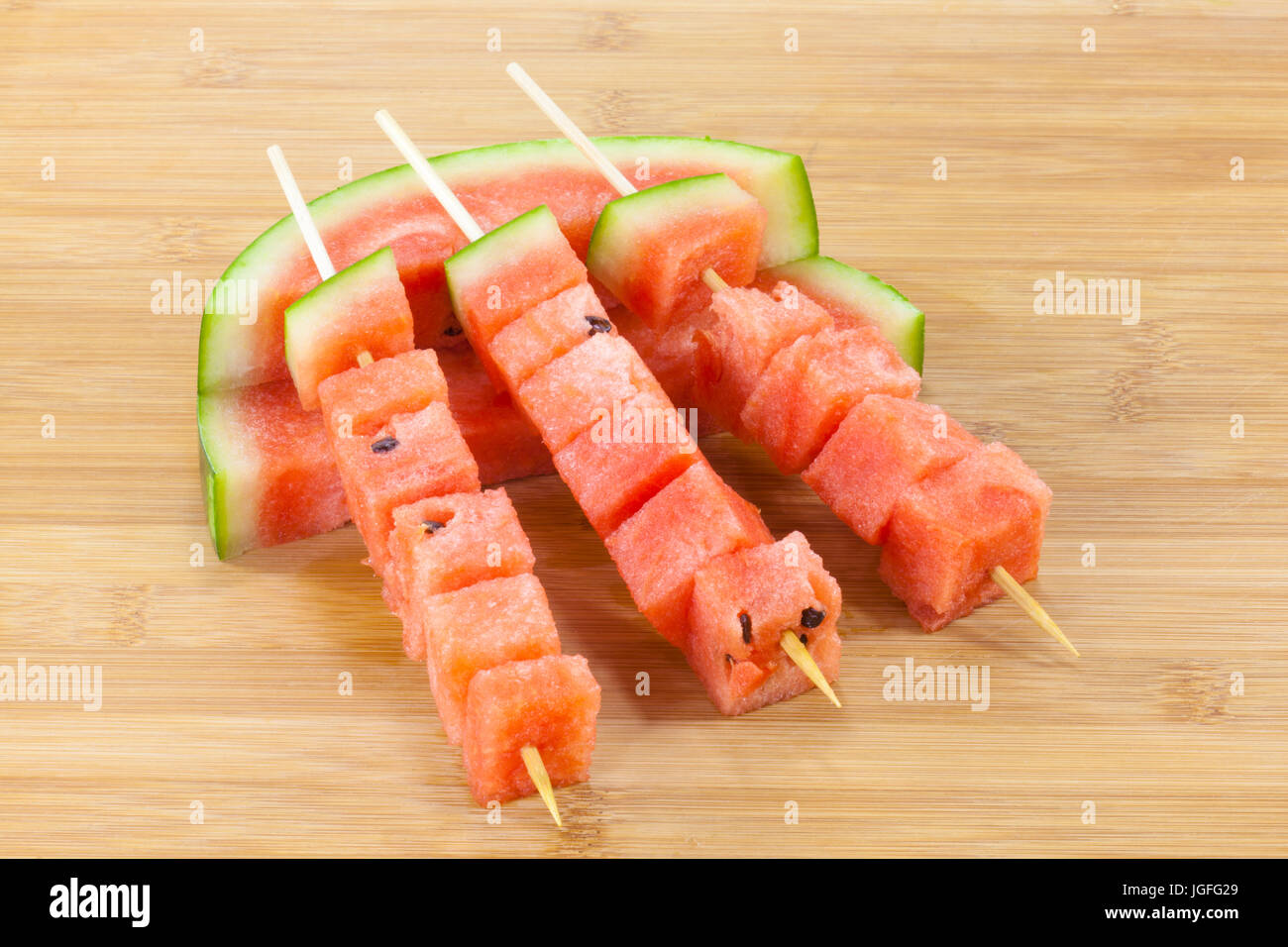 Tiny watermelon chuncks in skewer shape Stock Photo - Alamy