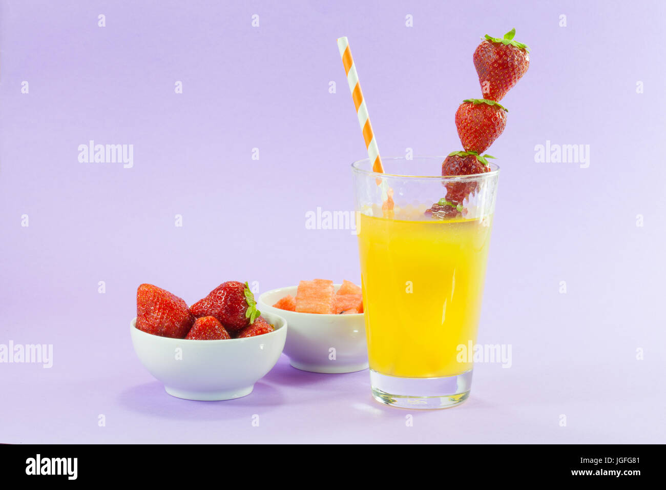 glass of refreshing drink: orange juice with strawberries Stock Photo ...
