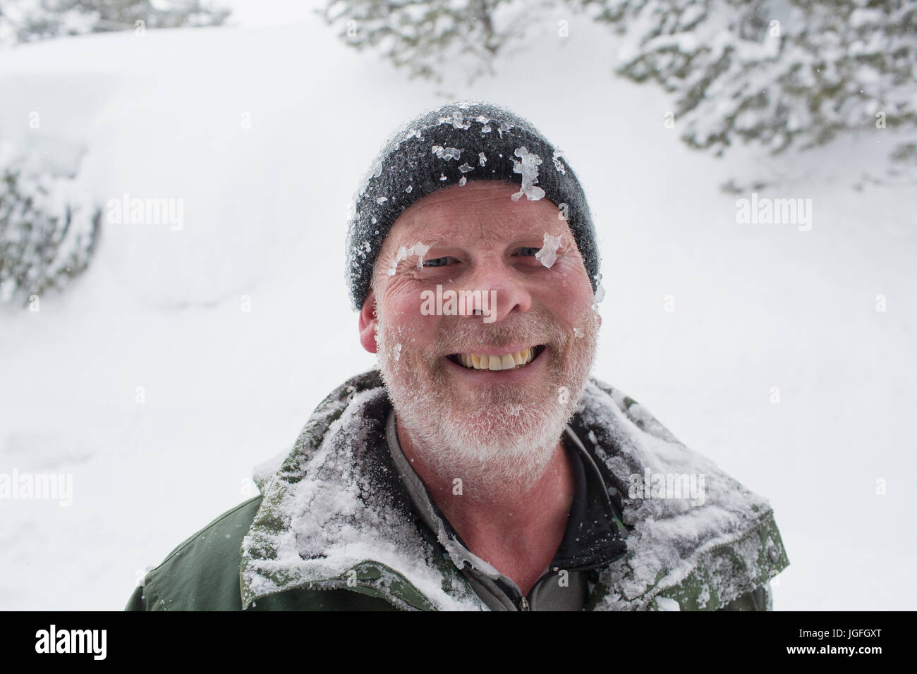 Caucasian man covered with ice and snow Stock Photo - Alamy
