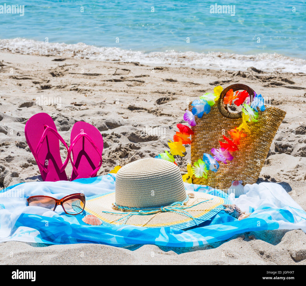 hat and other summer objects on the beach Stock Photo - Alamy