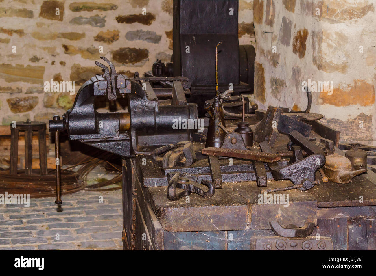 Old workbench with various tools and machines Stock Photo - Alamy