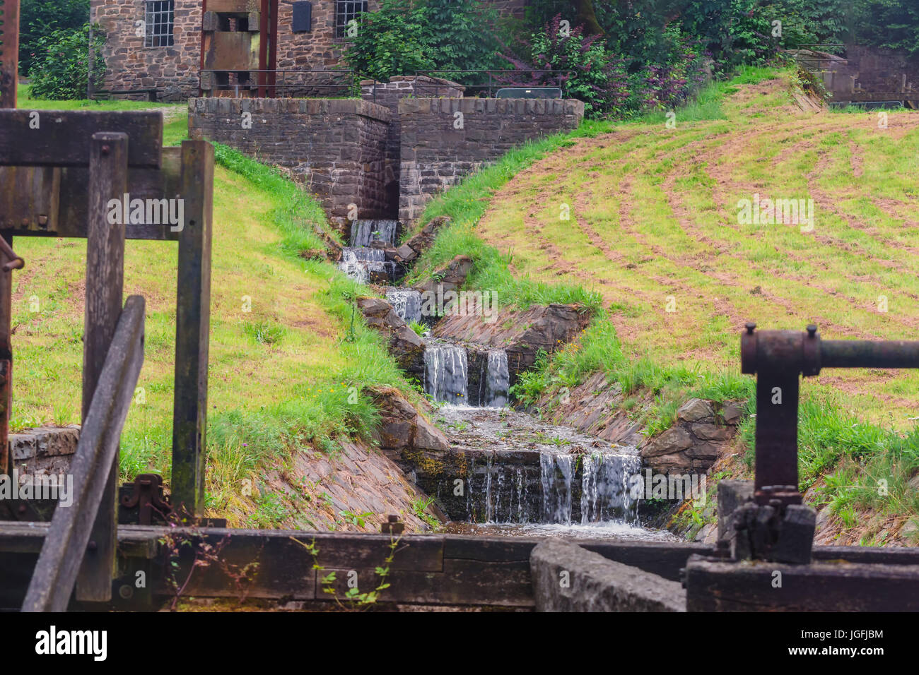 Small river to the water drive of a water mill Stock Photo - Alamy