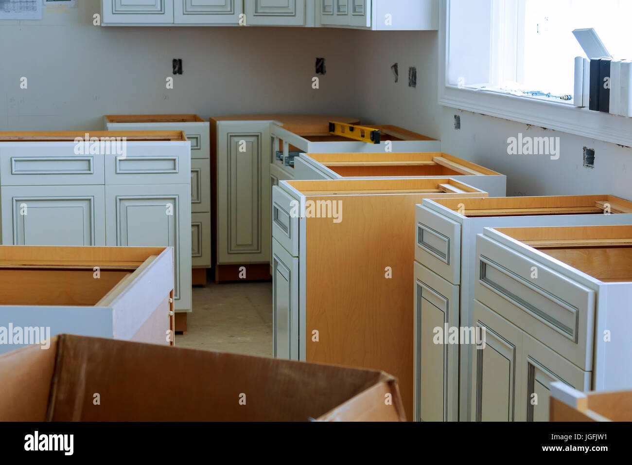 Installation of kitchen cabinets the drawer in cabinet Stock Photo - Alamy