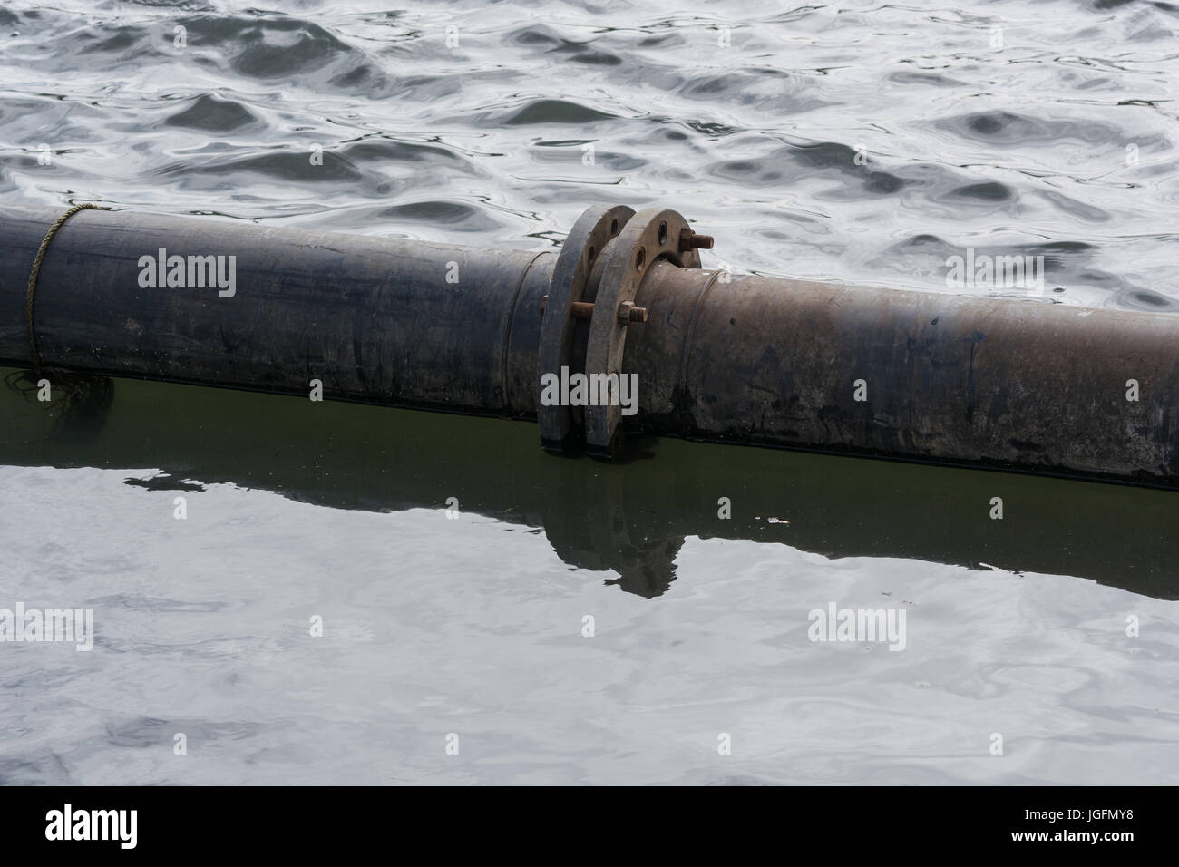 Pipeline, plastic pipes float on the water surface Stock Photo - Alamy