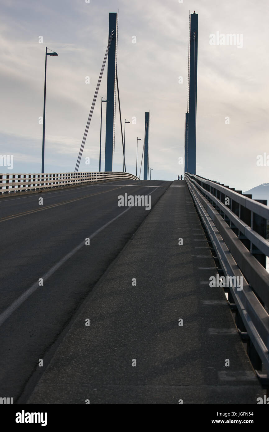 Two people in the distance walk across Sitka's O'Connell Bridge Stock ...