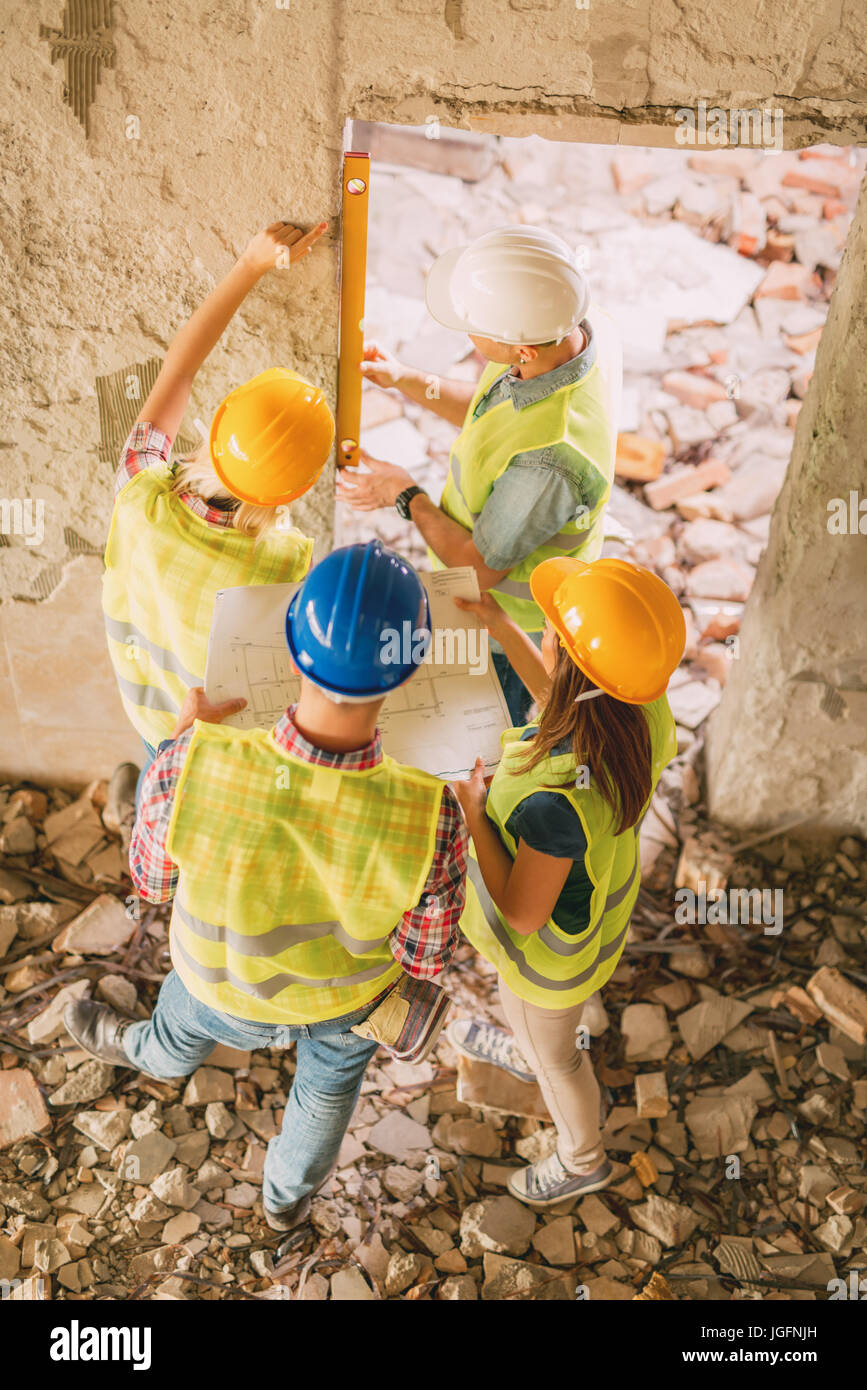 Four construction architects review building damaged in the disaster ...