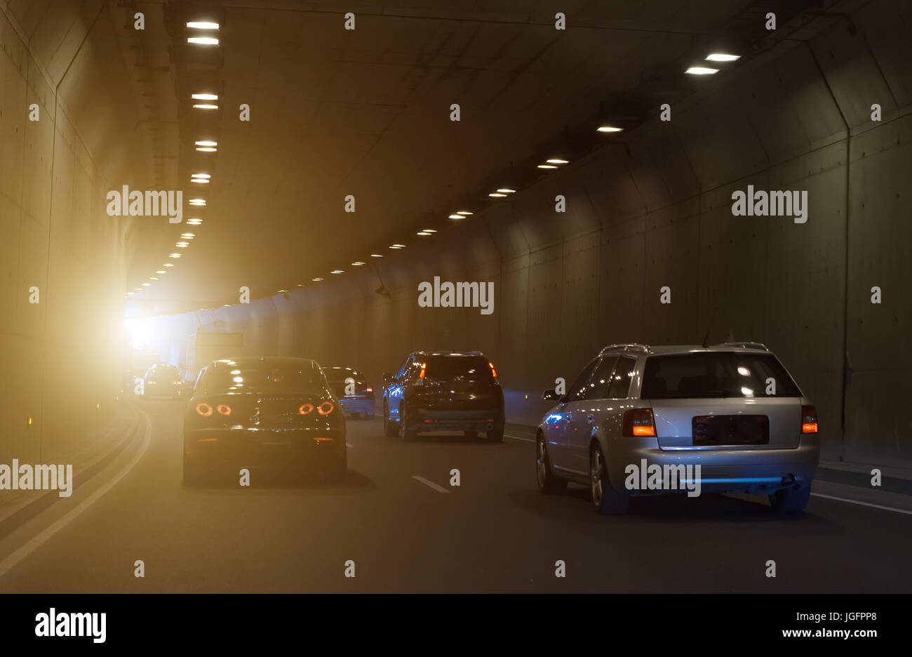 Cars driving through the tunnel Stock Photo - Alamy