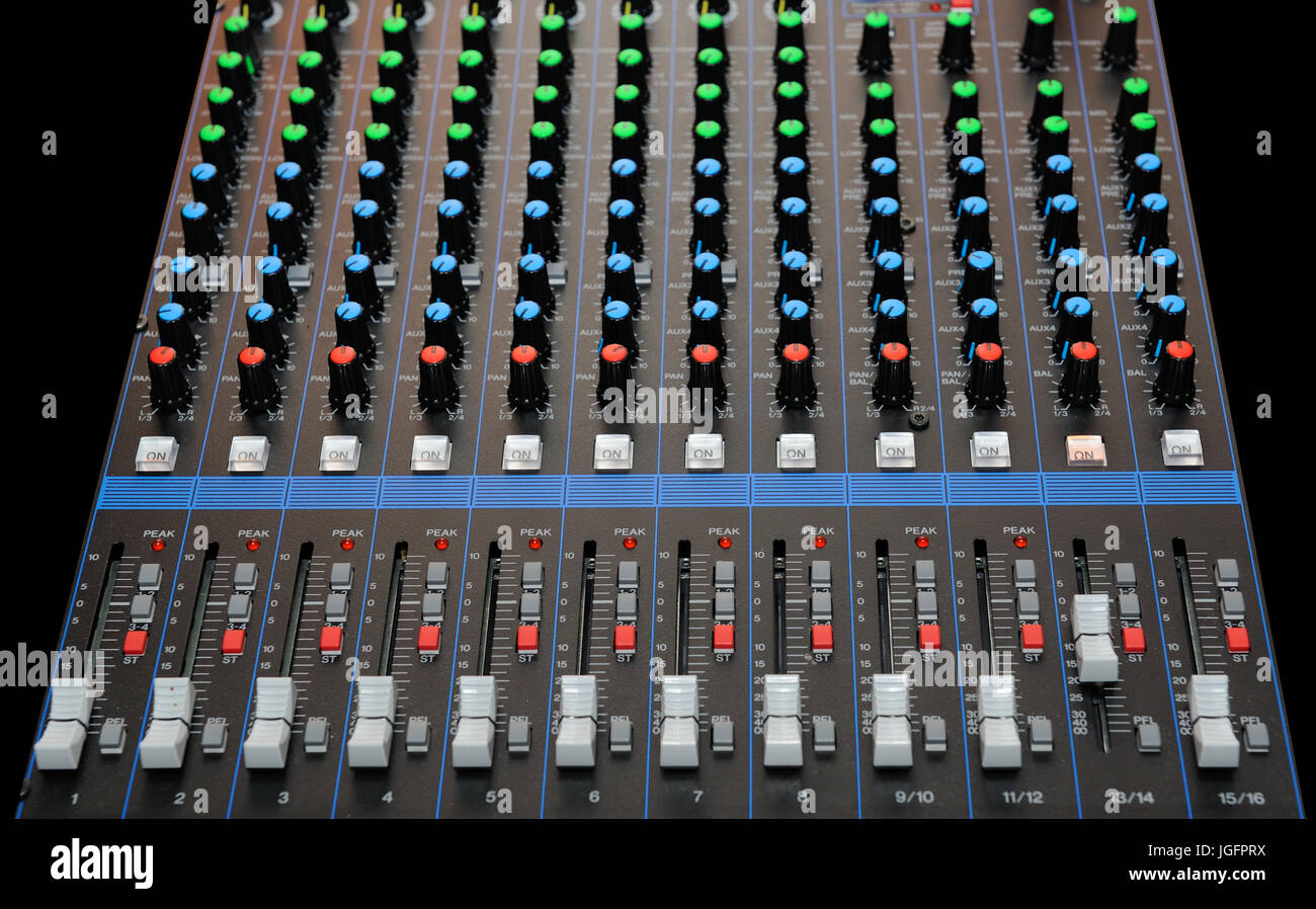 audio mixing console with faders and adjusting knobs Stock Photo - Alamy