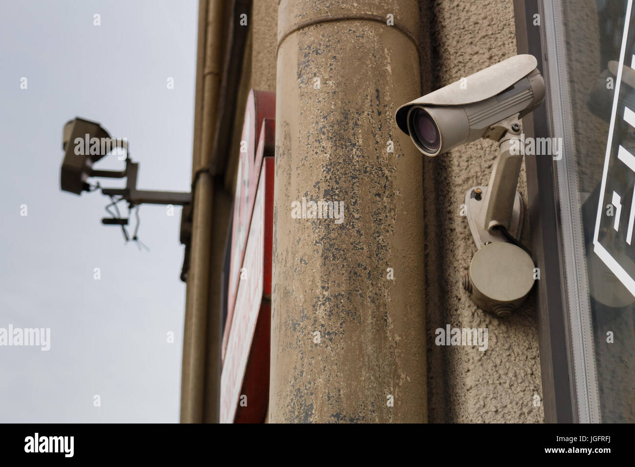 Video camera security system on the wall of the building Stock Photo ...