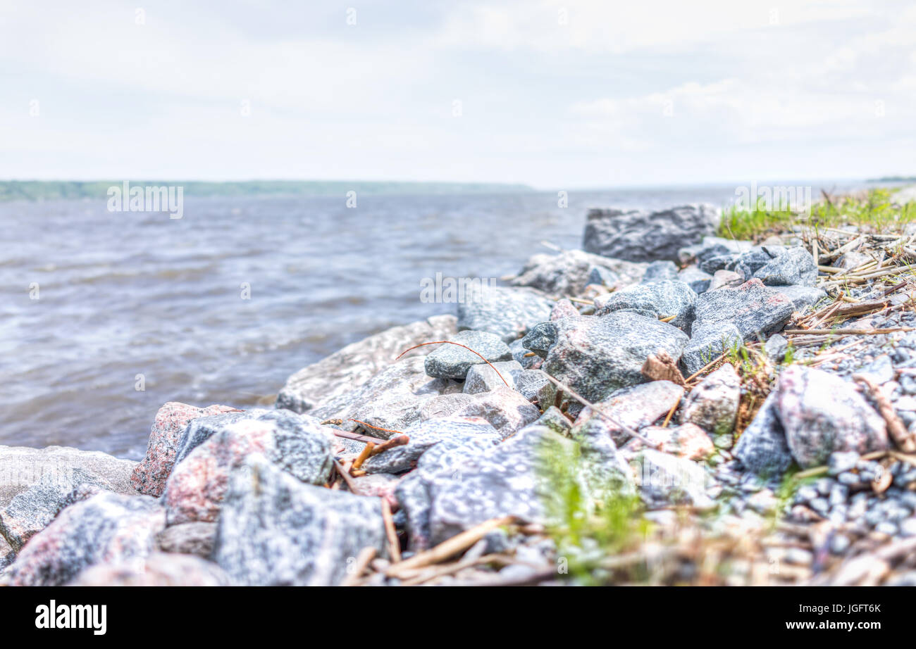 Colorful rocks on Saint Laurent or Lawrence river in Quebec, Canada ...