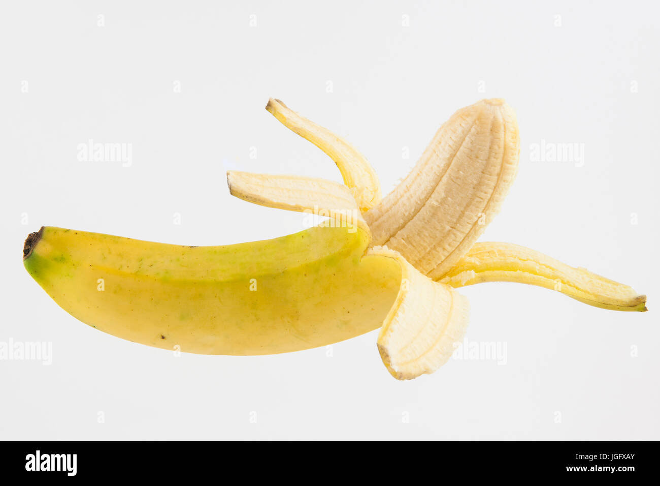 Half peeled banana (Musa acuminata) isolated on white background Stock ...