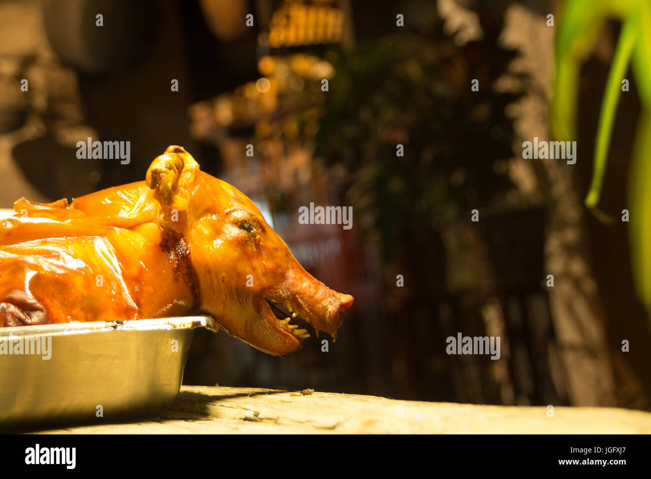 Photograph of a cooked piglet ready to be eaten Stock Photo - Alamy