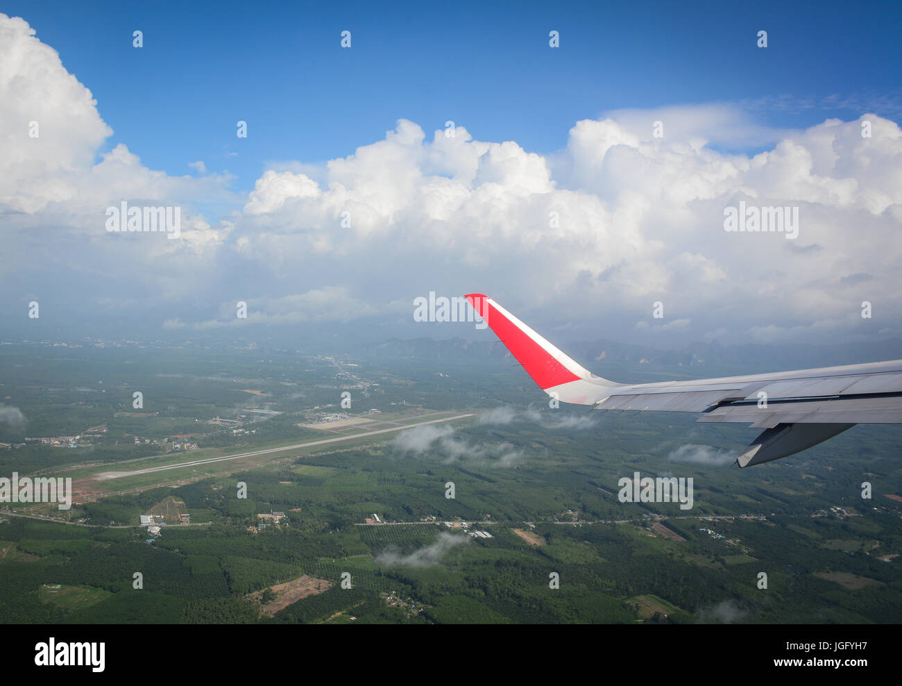 Looking through window aircraft during flight in wing. Blue sky and ...