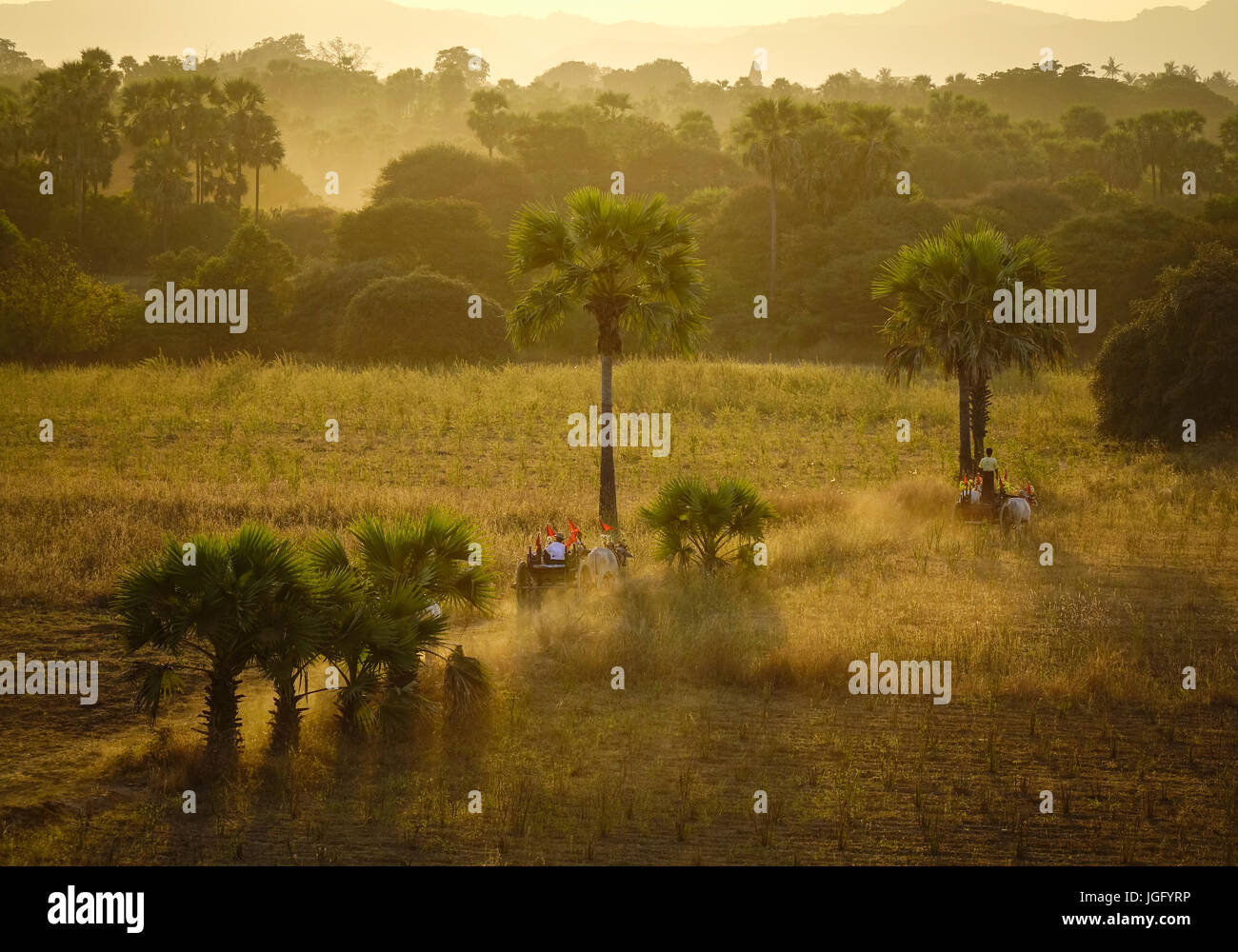 View of rural road at sunset in Bagan, Myanmar. Bagan is an ancient ...