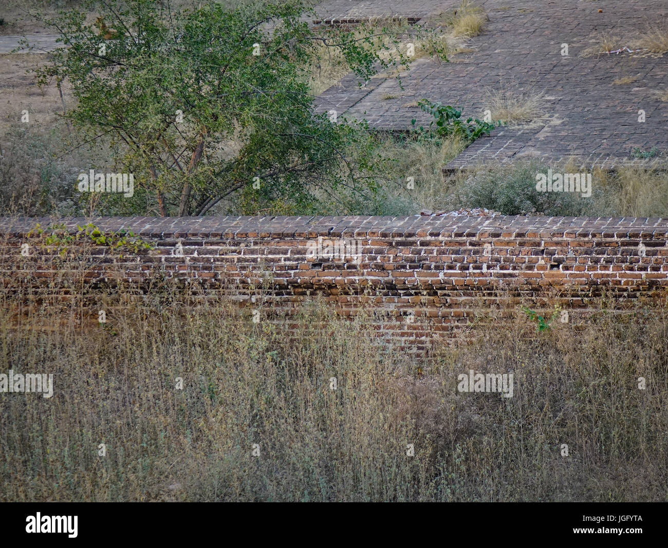 Ancient brick wall of a Buddhist temple in Bagan, Myanmar. Bagan is one ...