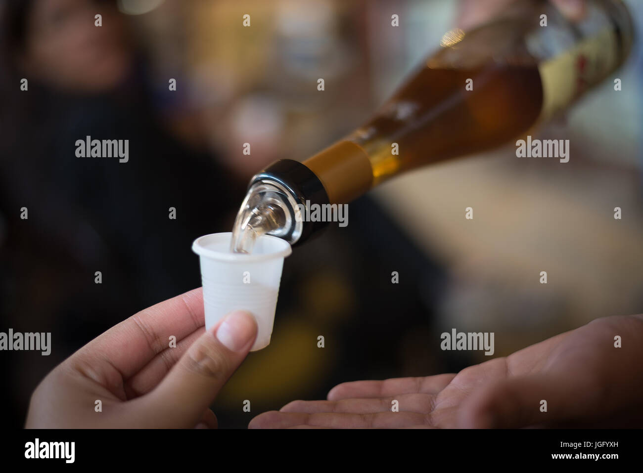 Giving tasting sample hi-res stock photography and images - Alamy