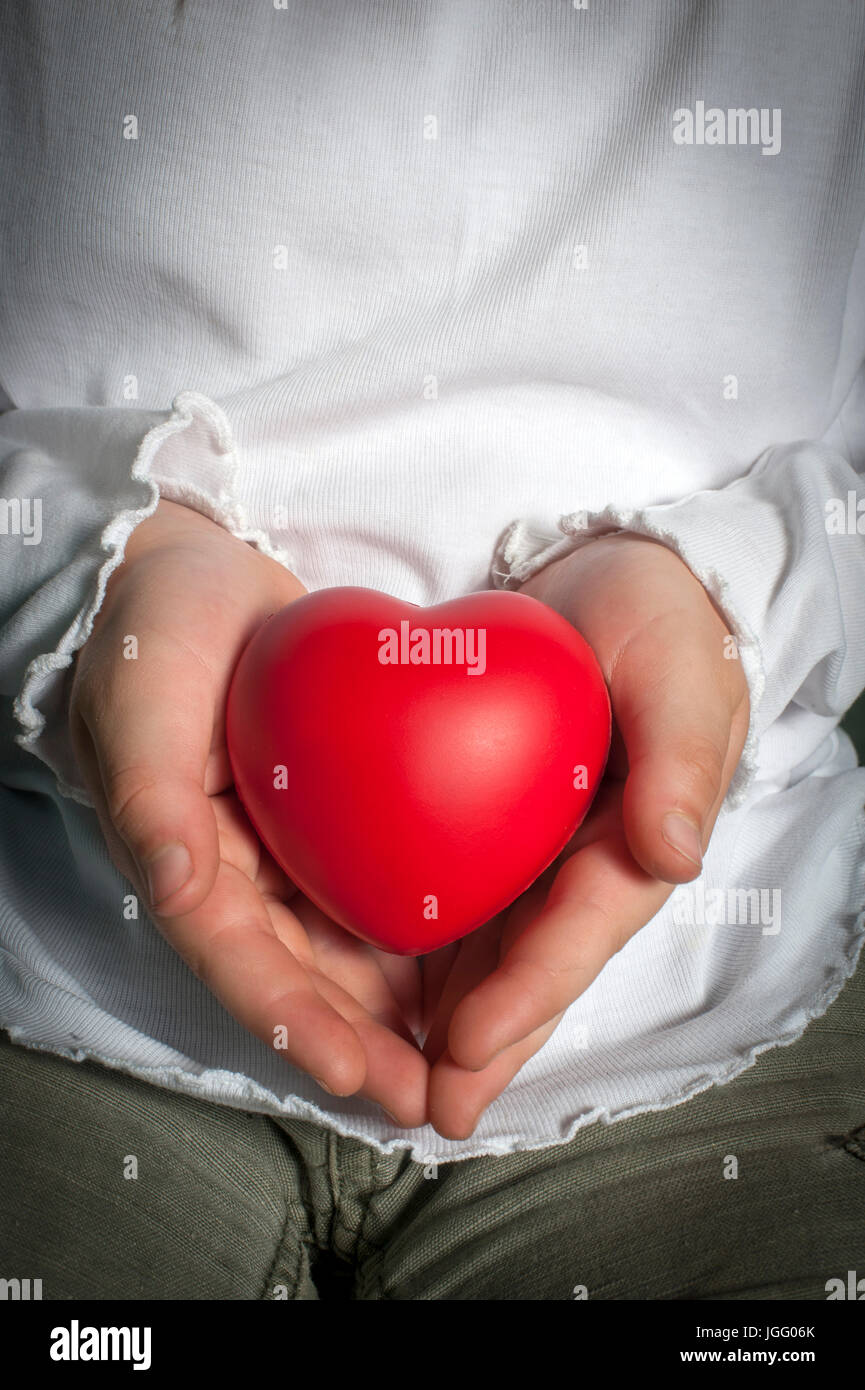 Hands holding broken heart hi-res stock photography and images - Alamy
