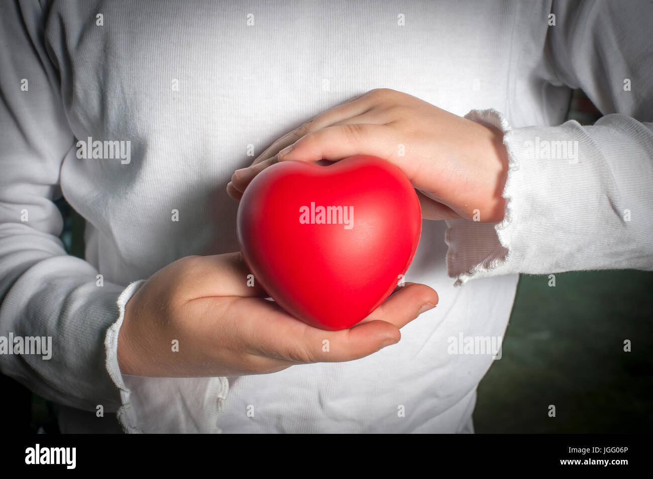 Heart in your hands Stock Photo - Alamy