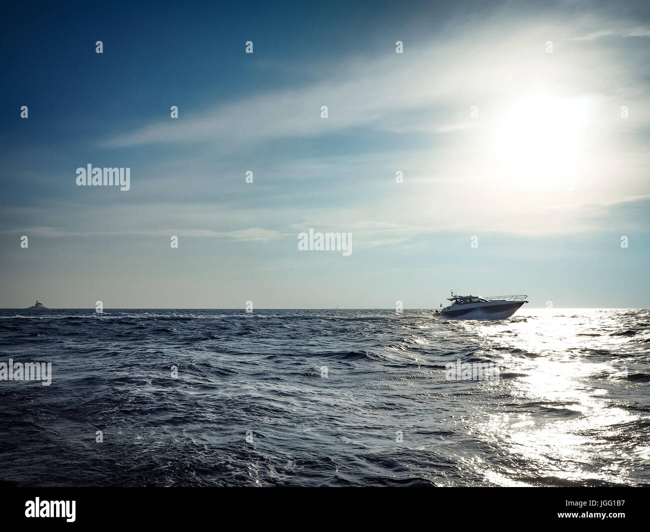 Speed boat sunset Stock Photo - Alamy