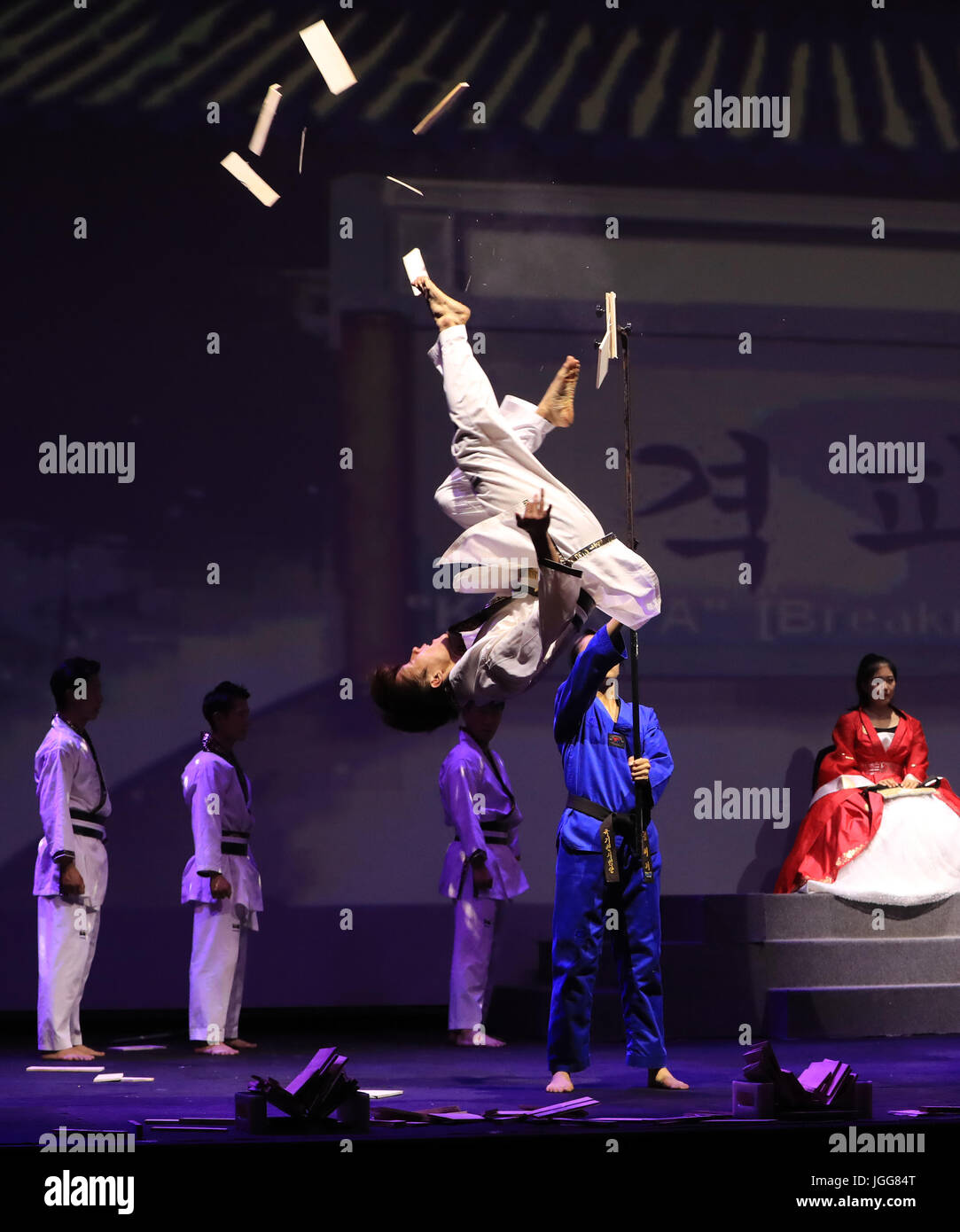 Taekwondo performance A taekwondo player performs a jumping kick during ...