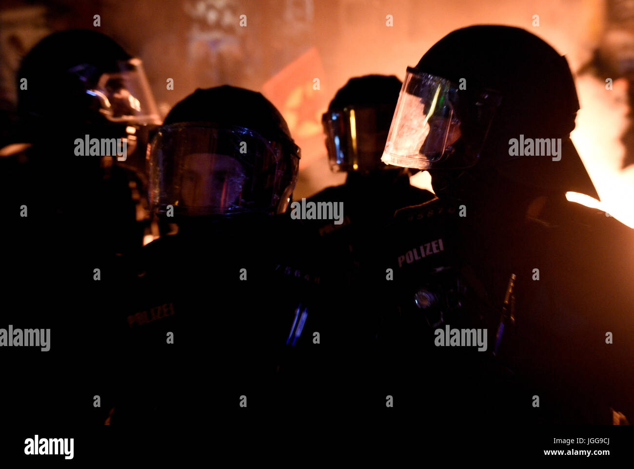 Police in riot gear in front of a fire hi-res stock photography and ...