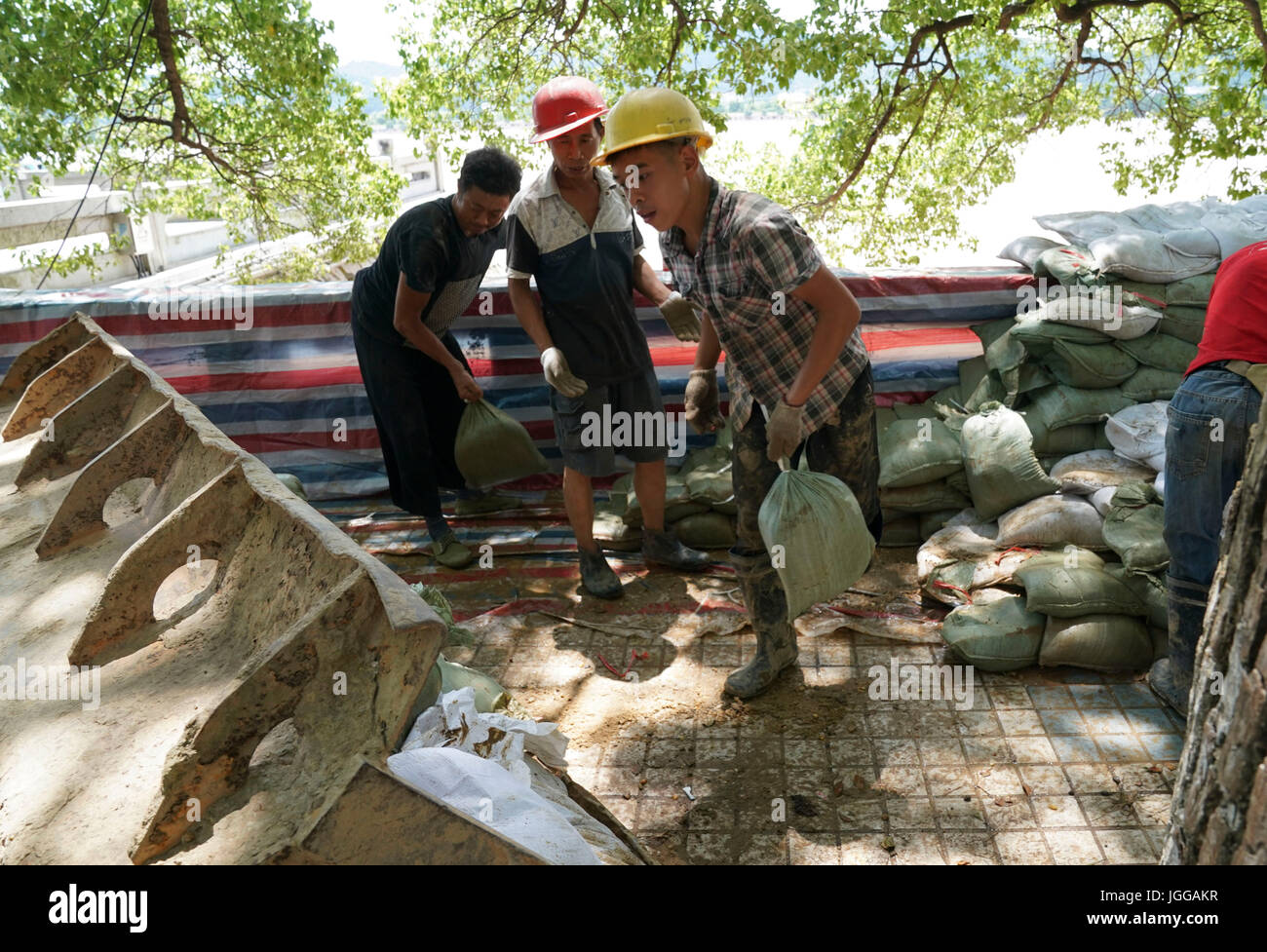 Changsha, China's Hunan Province. 7th July, 2017. Workers tear off ...