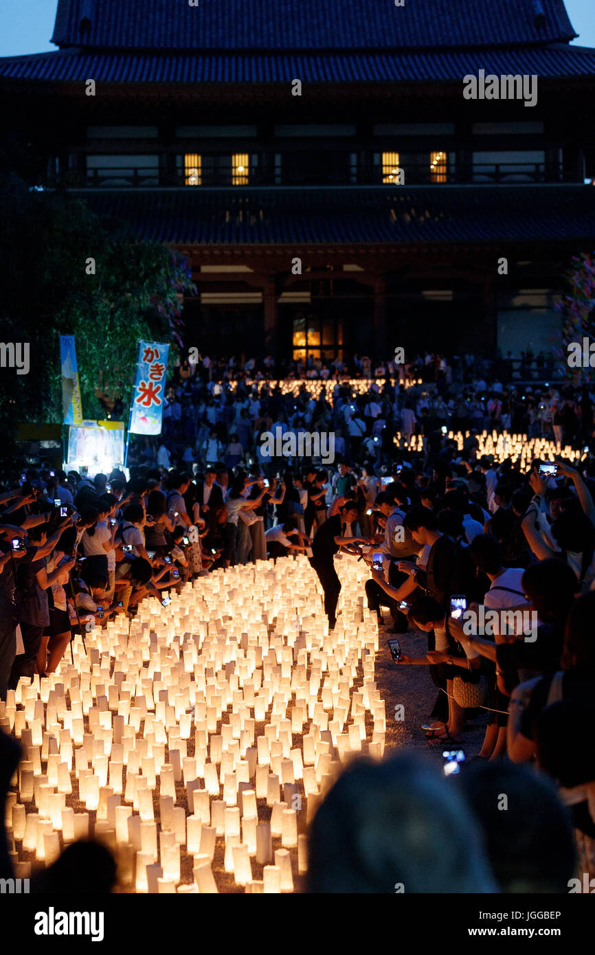 Tokyo, Japan. 7th Jul, 2017. Visitors take pictures of the lanterns on ...