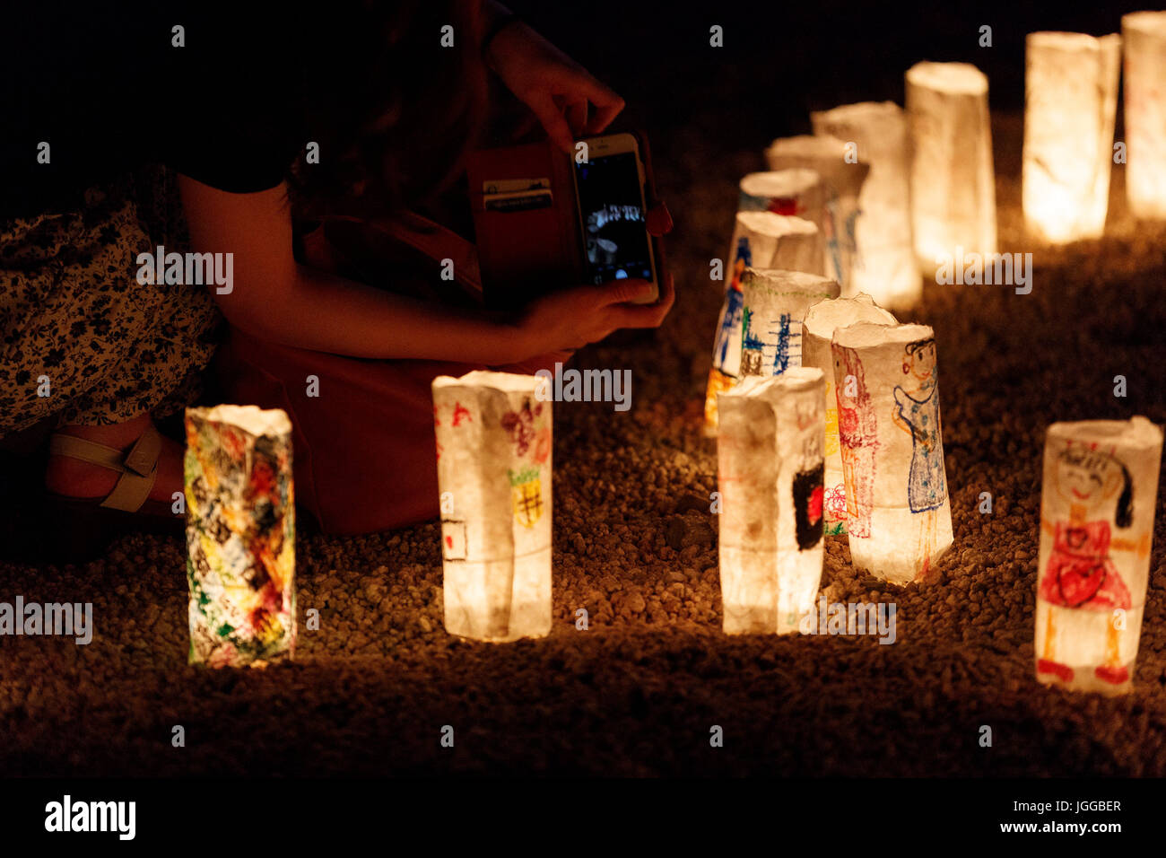 Tokyo, Japan. 7th Jul, 2017. A visitor takes pictures of the lanterns ...