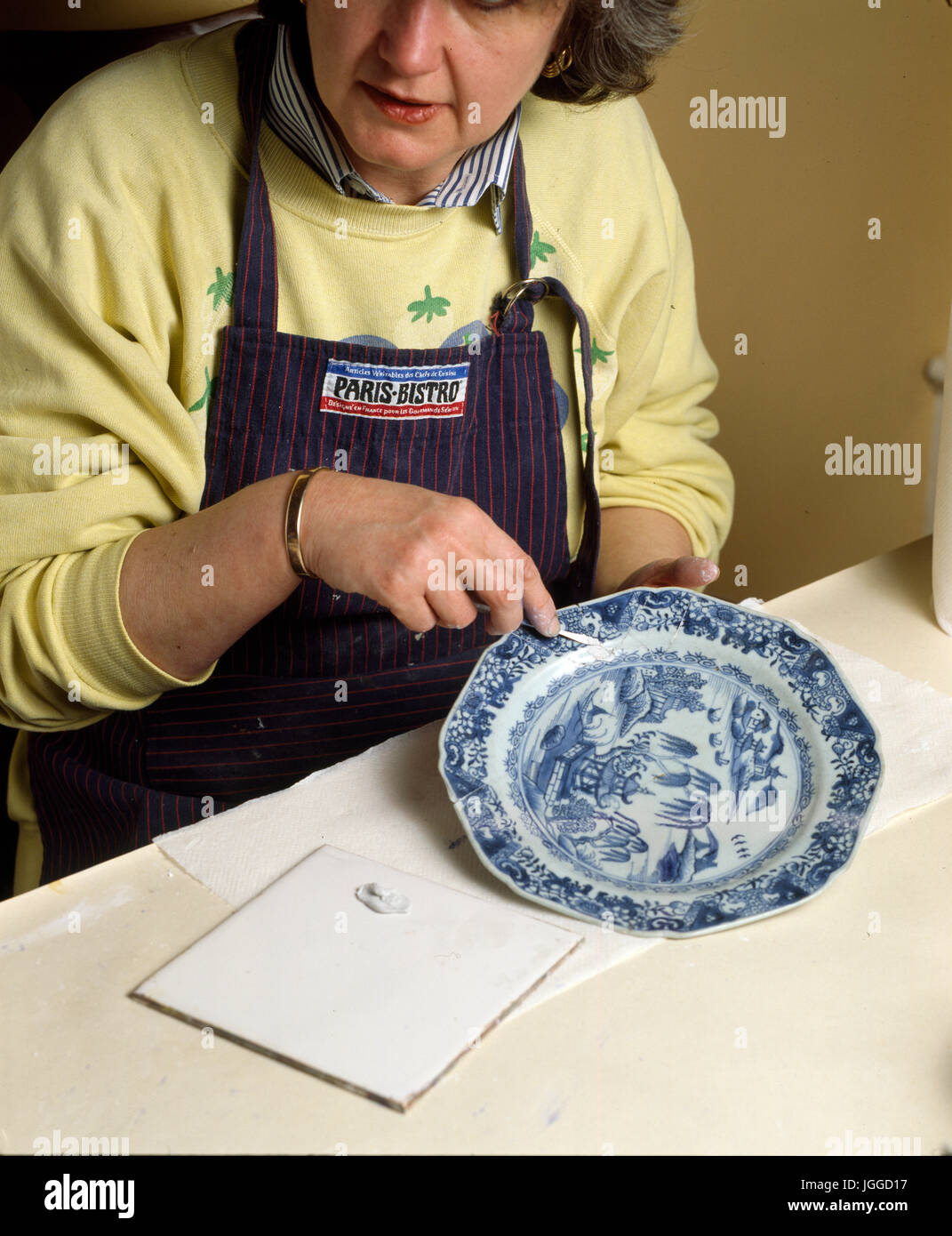 Mending a broken plate Stock Photo - Alamy