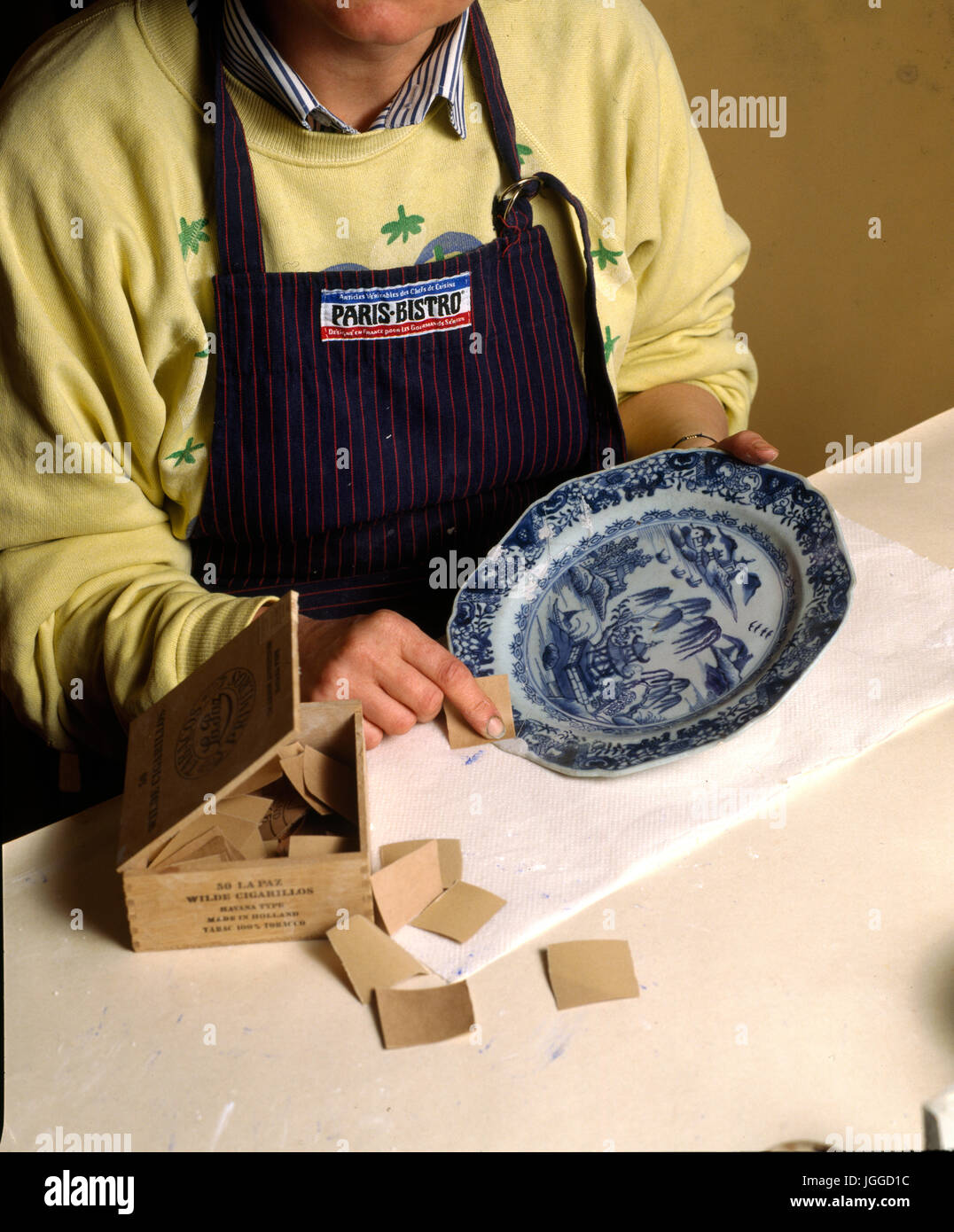 Mending a broken plate Stock Photo - Alamy