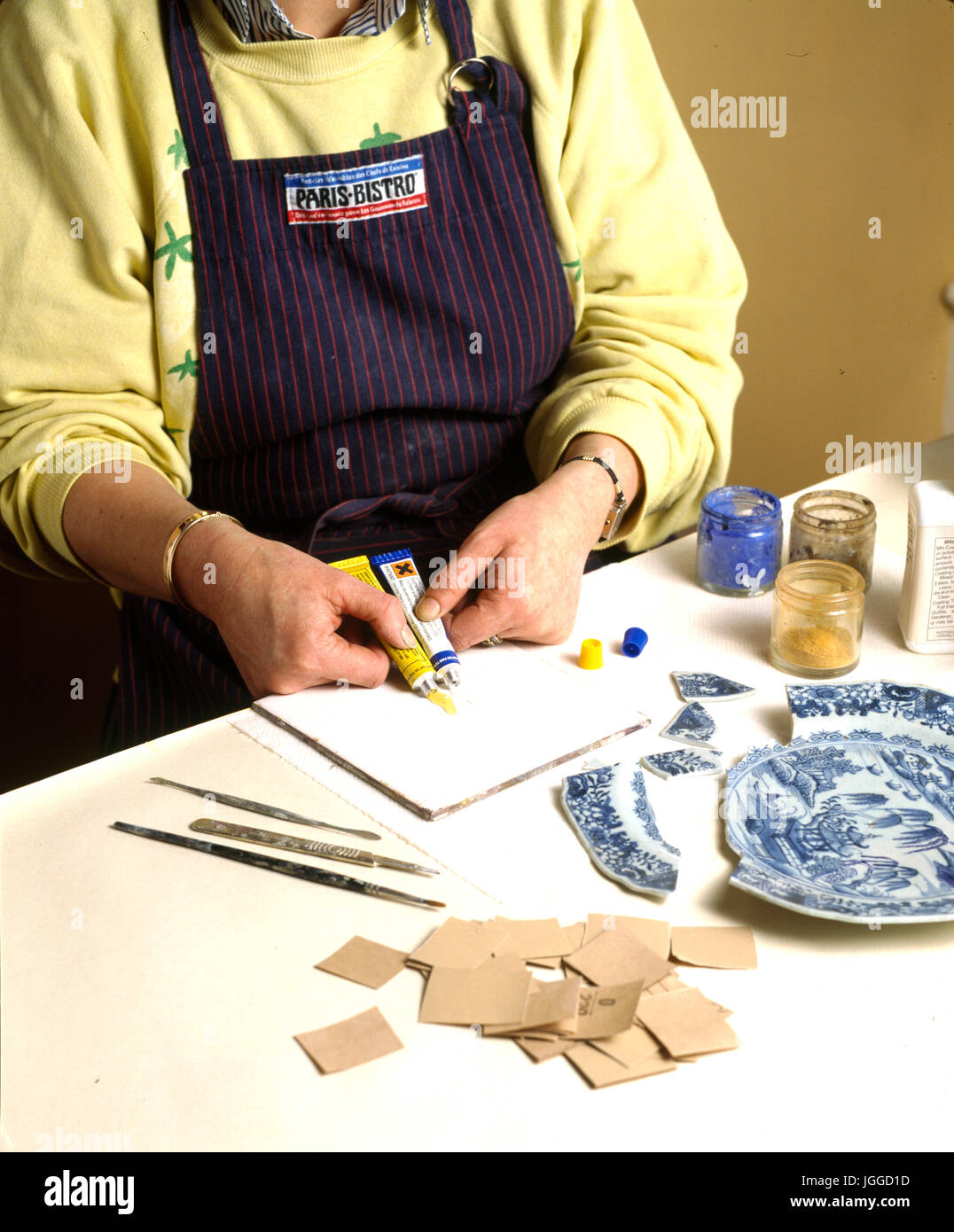 Mending a broken plate Stock Photo - Alamy