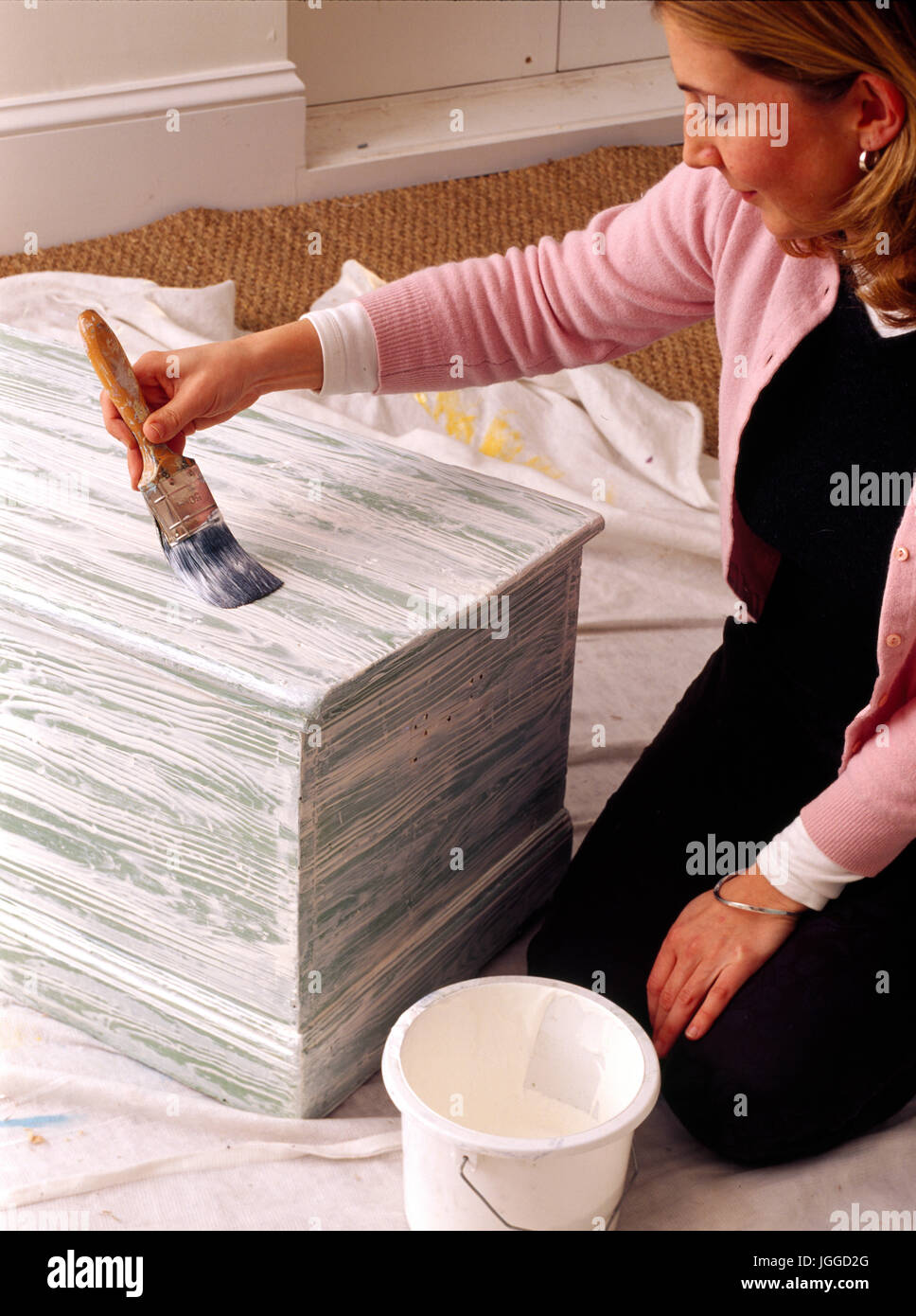Renovation projects: Painting a wooden chest Stock Photo - Alamy