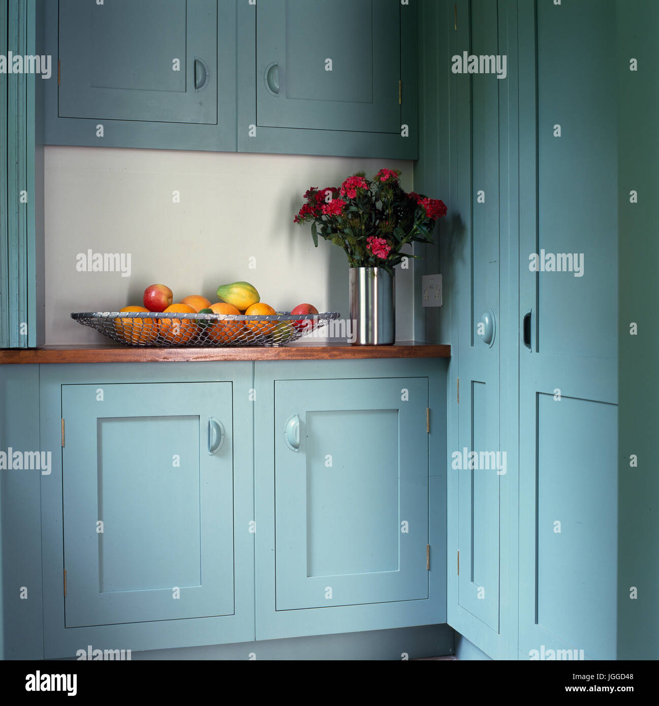Fitted cupboards in pale blue traditional kitchen Stock Photo - Alamy