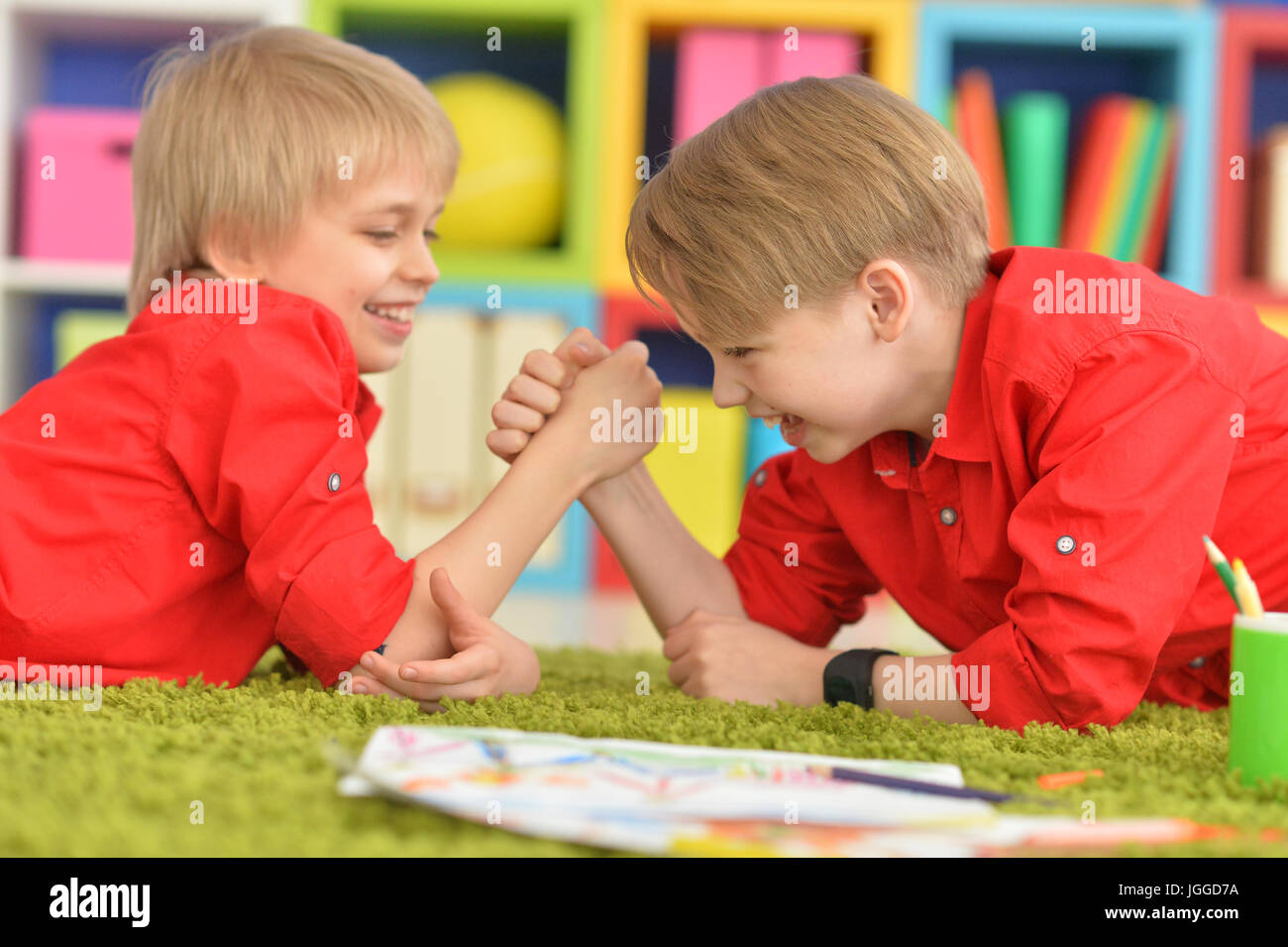 Two brothers draws with pencils Stock Photo - Alamy