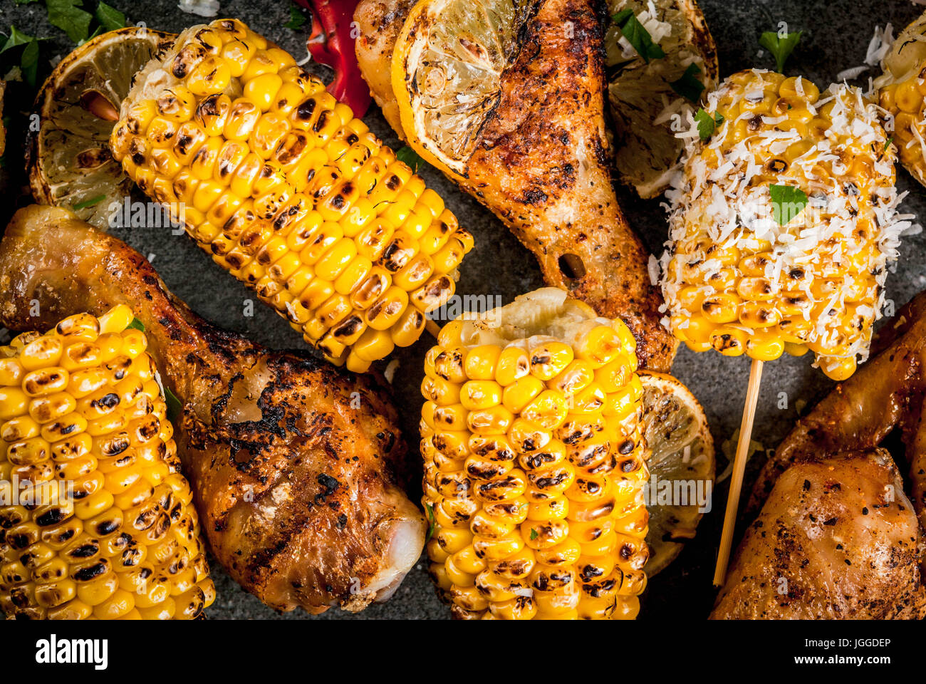 Summer food. Ideas for barbecue, grill party. Corn and chicken (legs ...
