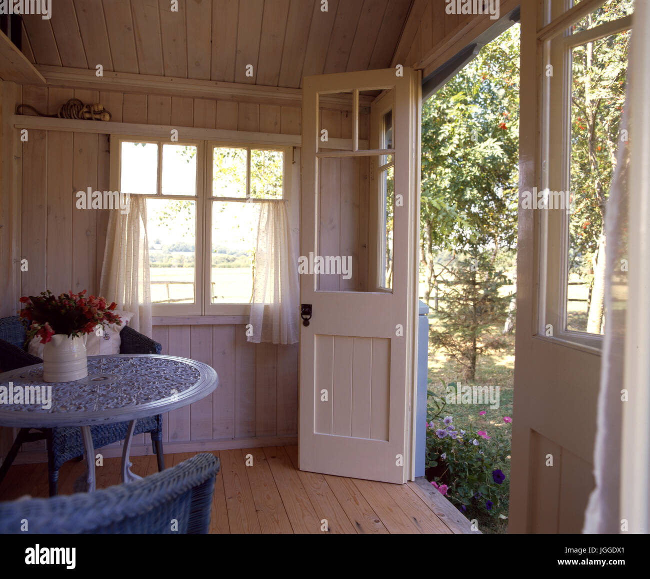 Inside summer house at bottom of the garden Stock Photo - Alamy