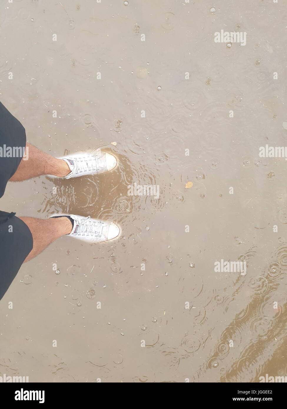 One hour of african rain cause ankle deep puddle Stock Photo - Alamy