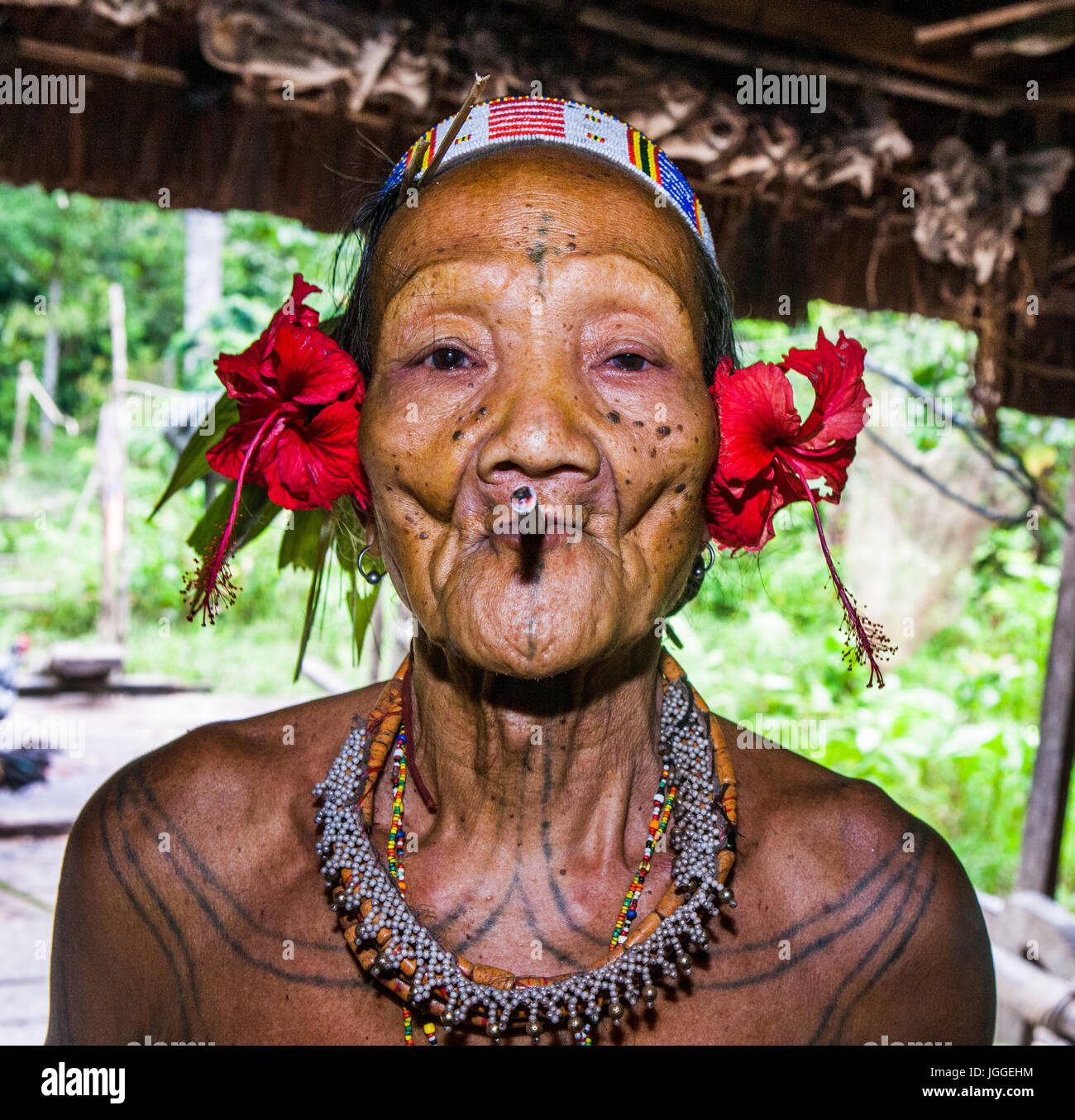 MENTAWAI PEOPLE, WEST SUMATRA, SIBERUT ISLAND, INDONESIA – 16 NOVEMBER 2010: Portrait of a man ...