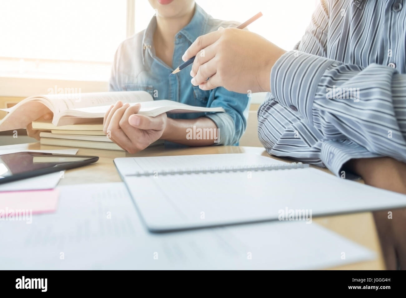 Young students campus helps friend catching up and learning tutoring ...