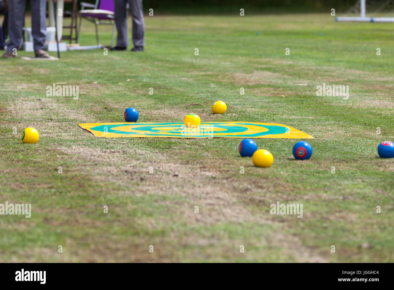 Grass bowls target practise bullseye bright yellow blue grass amateur ...