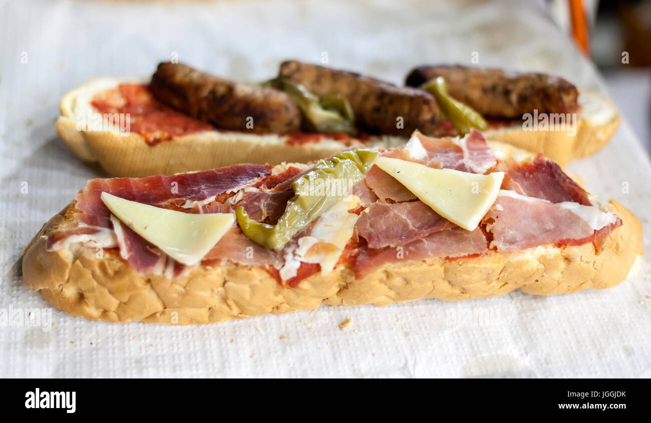 Traditional spanish tapas with traditional serrano ham, cheese and ...