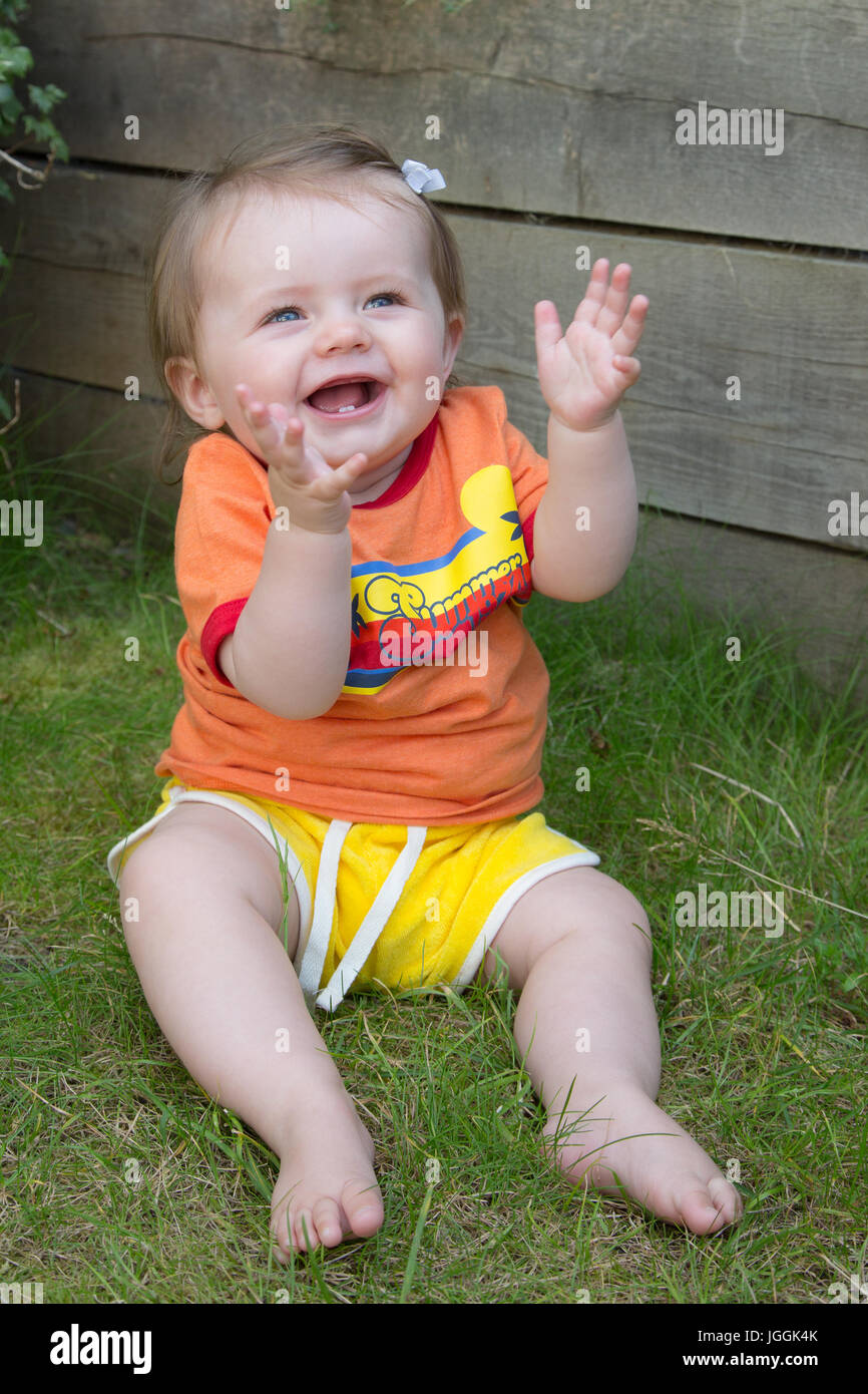 Happy 9 month old baby hi-res stock photography and images - Alamy
