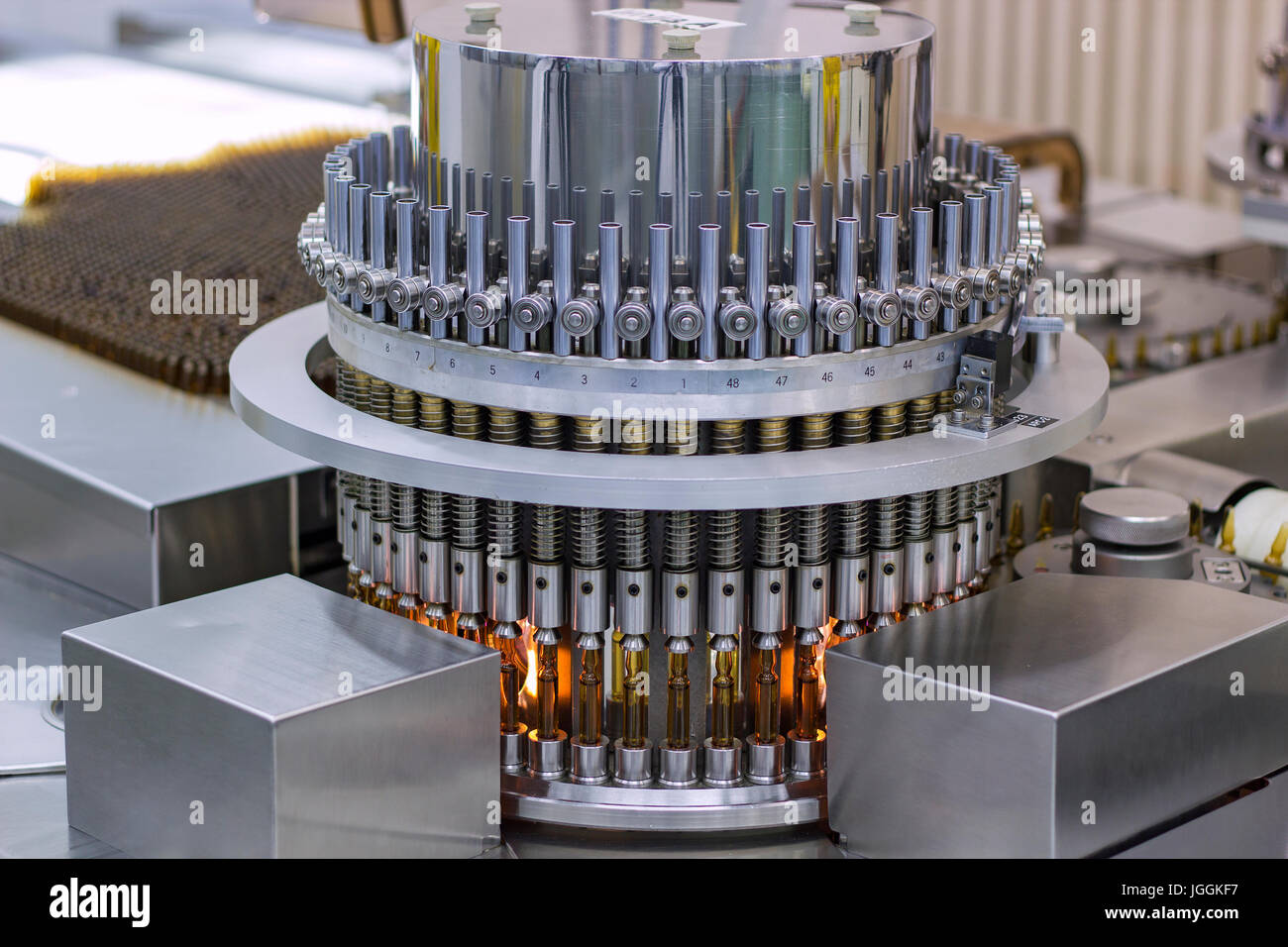 Inspects vials and ampules for particulates in liquid and container ...