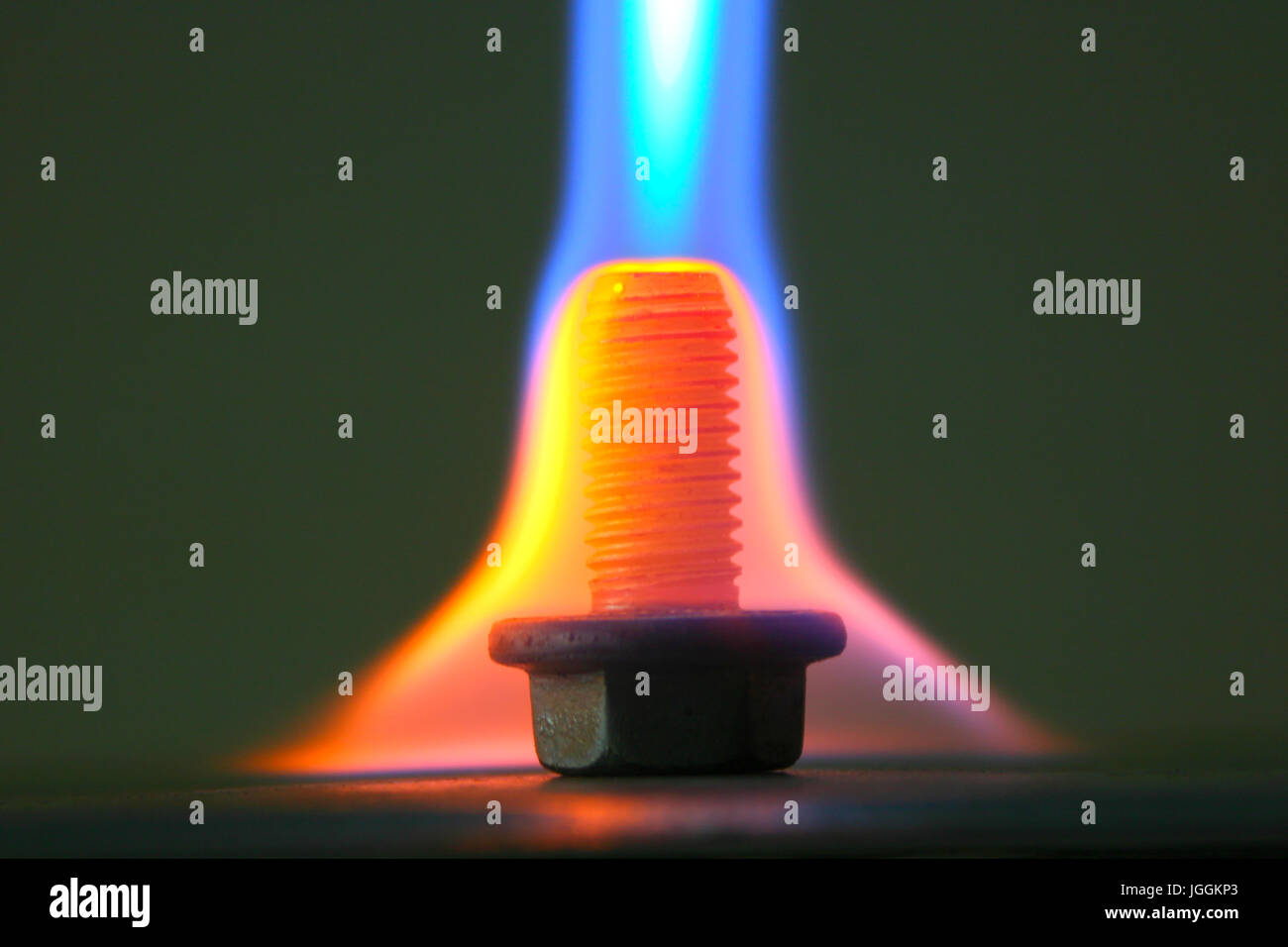 Bolt heated with gas torch closeup Stock Photo - Alamy