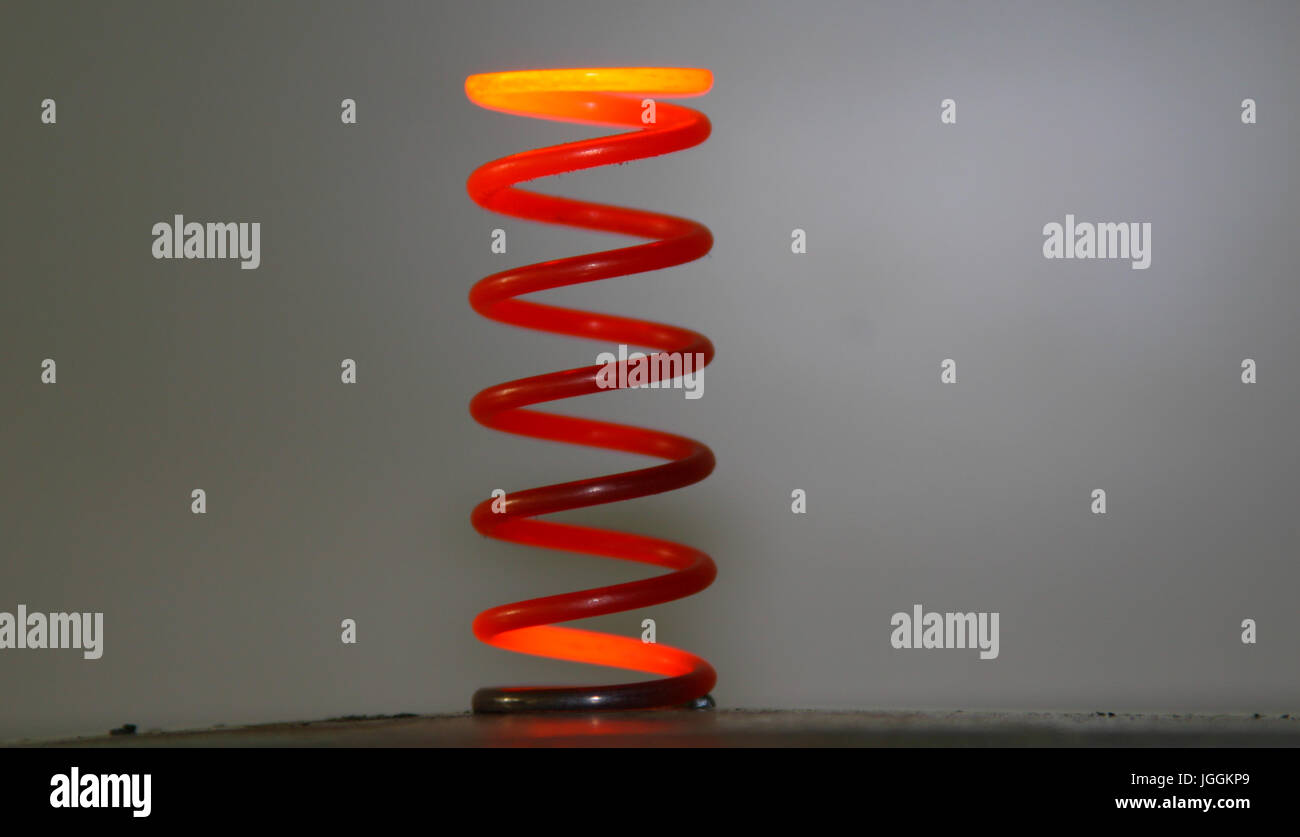 Red hot glowing steel spring Stock Photo - Alamy