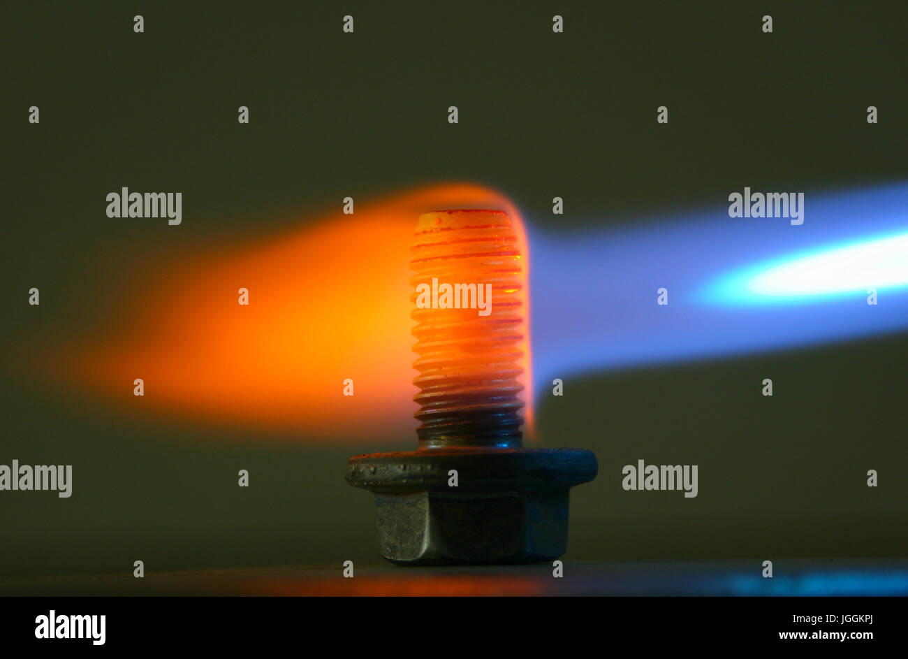 Bolt heated with gas torch closeup Stock Photo - Alamy