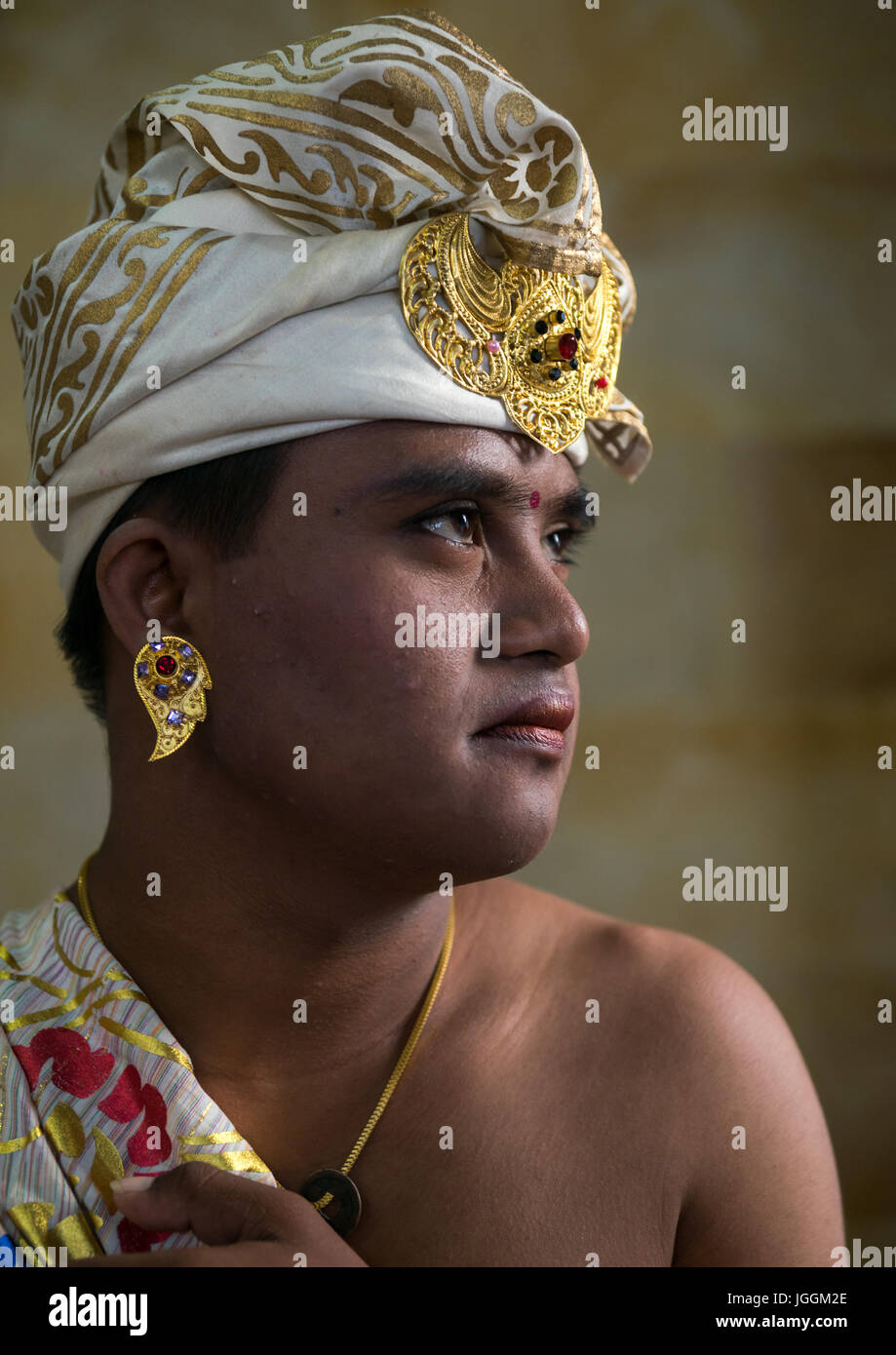 A teenage boy in traditional costume before a tooth filing ceremony ...