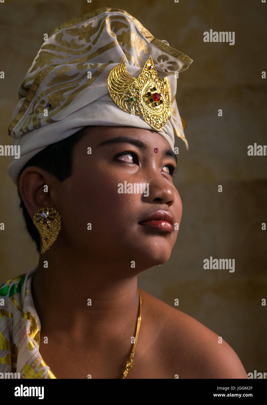 A teenage boy in traditional costume before a tooth filing ceremony ...