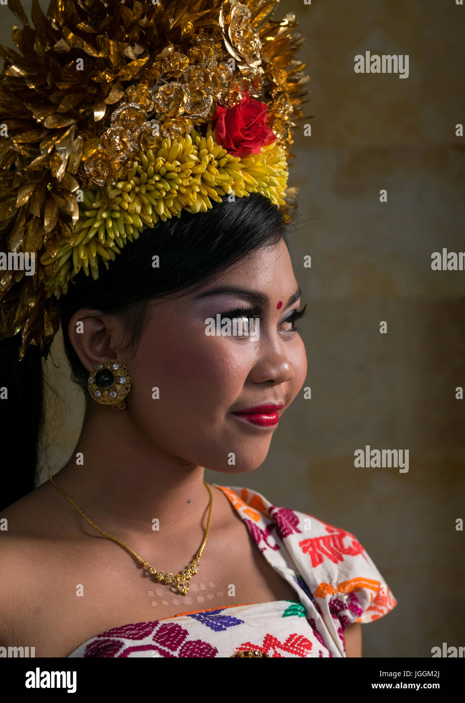 A teenage girl in traditional costume before a tooth filing ceremony ...